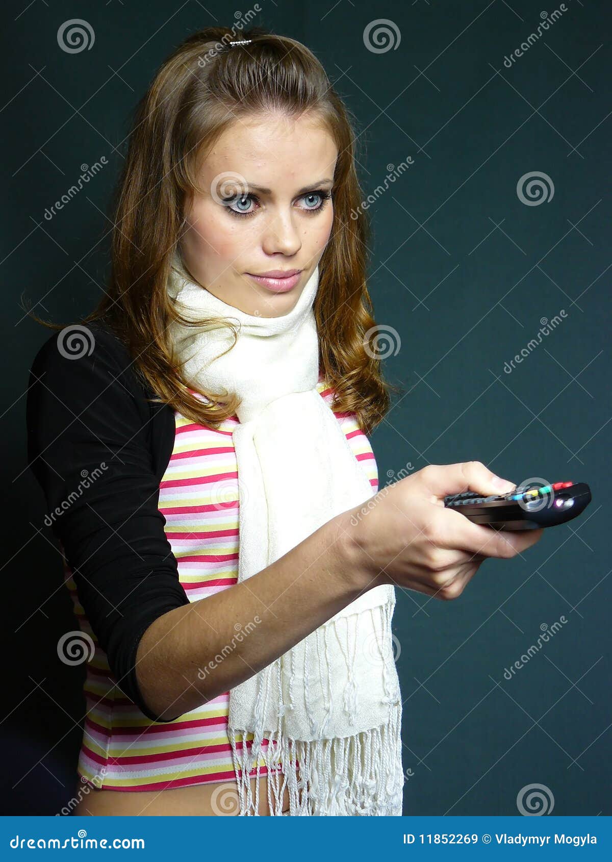Young Girl with a Remote Control Panel Stock Image - Image of shirt ...