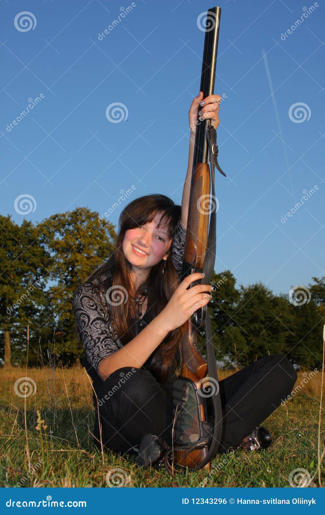 Young girl with rifle stock photo. Image of happiness - 12343296