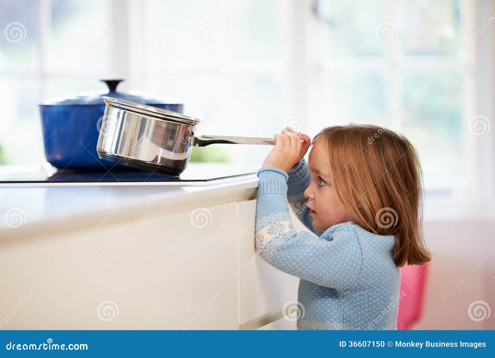 Young Girl Risking Accident with Pan in Kitchen Stock Photo - Image of ...