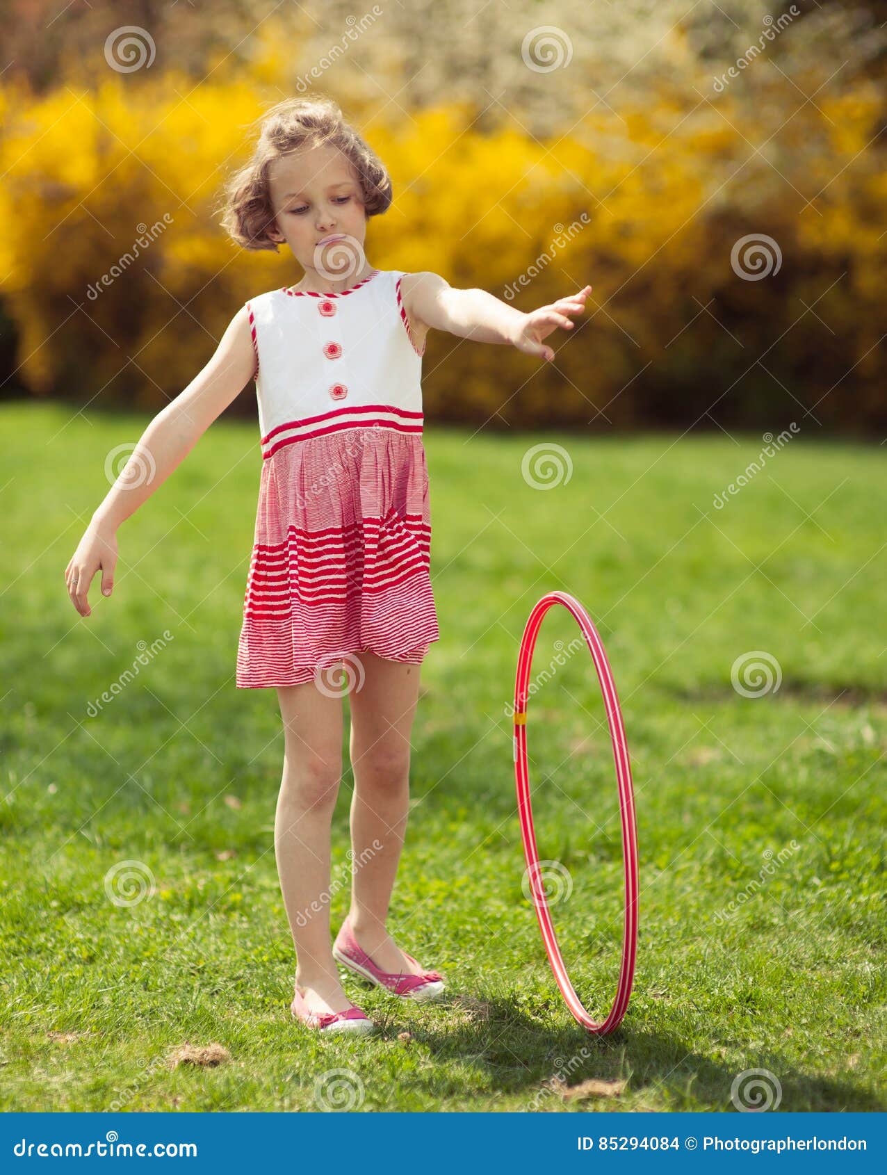 Young Girl Rolling Hula Hoop in Park Stock Photo - Image of casual ...