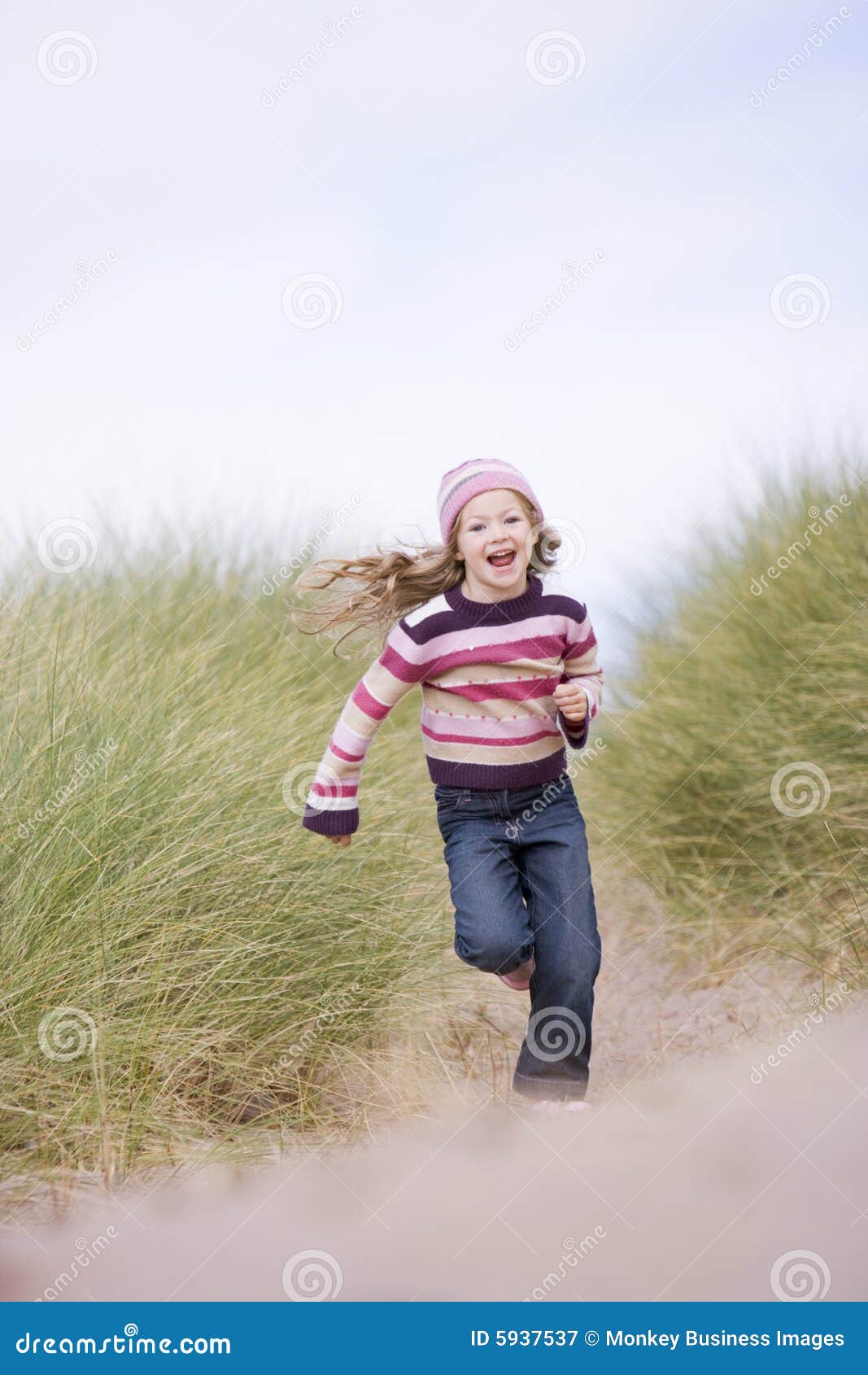 Young Girl Running on Beach Smiling Stock Image - Image of angle ...