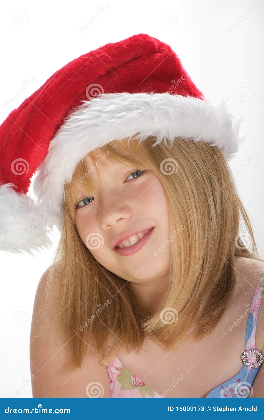 Young girl in a santa hat stock photo. Image of pretty - 16009178