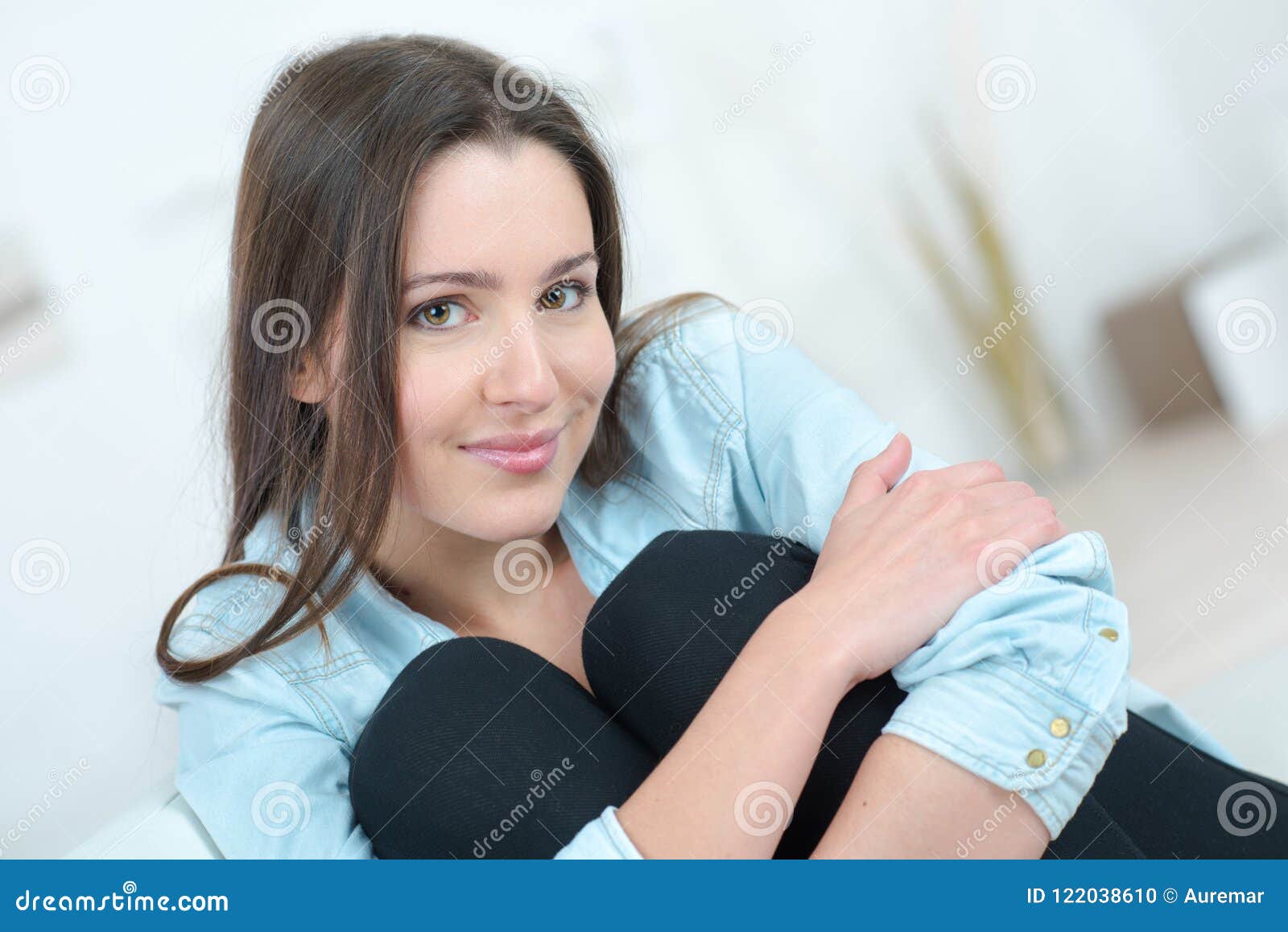 Young Girl Sat Hugging Knees Stock Photo - Image of girl, adult: 122038610