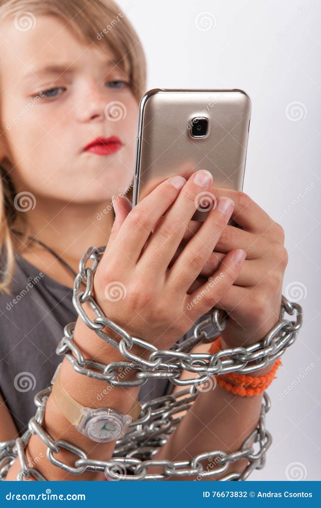 Young Girl Shackled with a Chain Using Smartphone Stock Photo - Image ...
