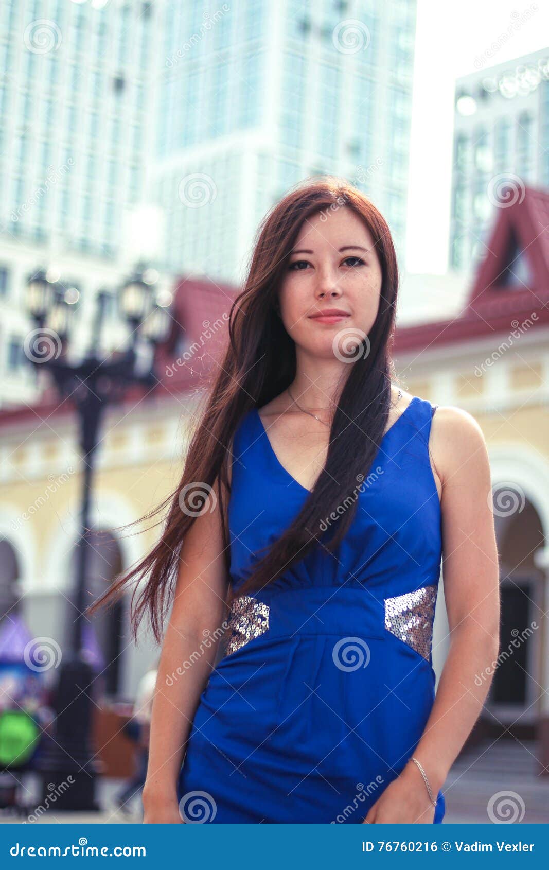 Young Girl. Shot from Below. Cityscape Background Stock Photo - Image ...