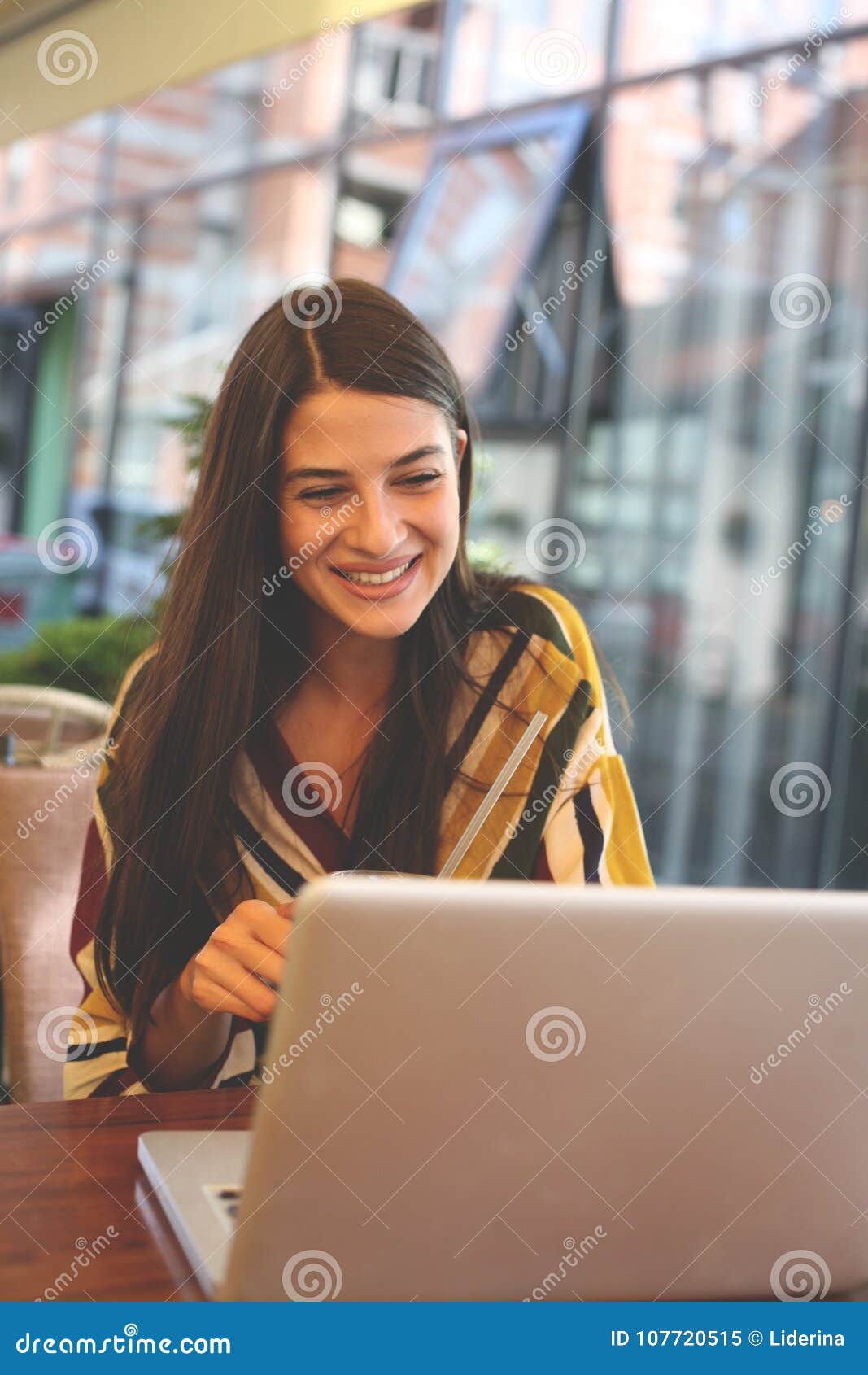 Young Girl Sitting in Cafe and Using Laptop. Stock Image - Image of ...