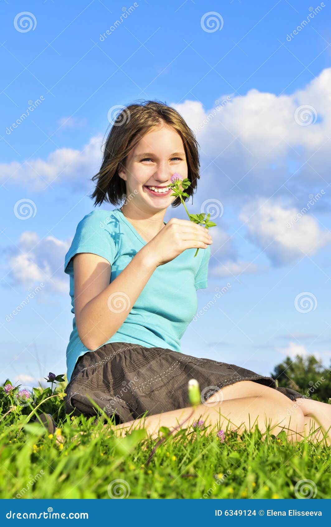 Young Girl Sitting on Grass Stock Photo - Image of lifestyle, leisure ...