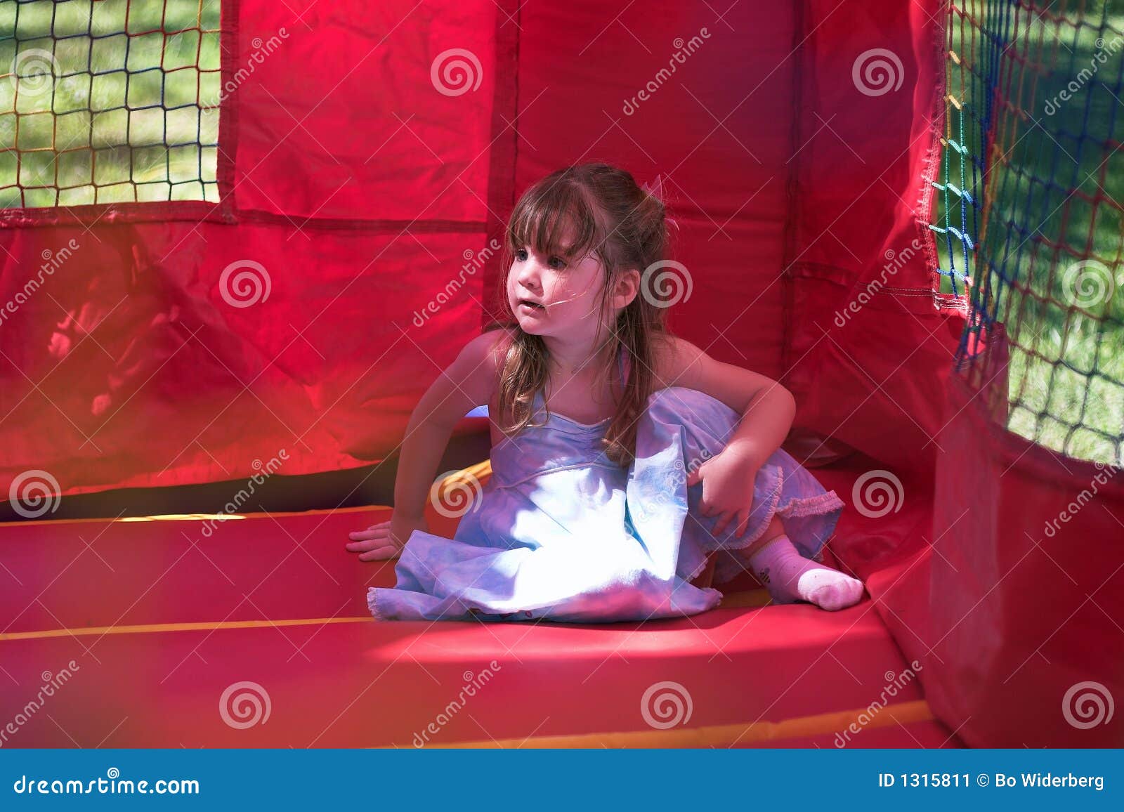 Young Girl Sitting in an Inflatable Bouncy Stock Image - Image of ...