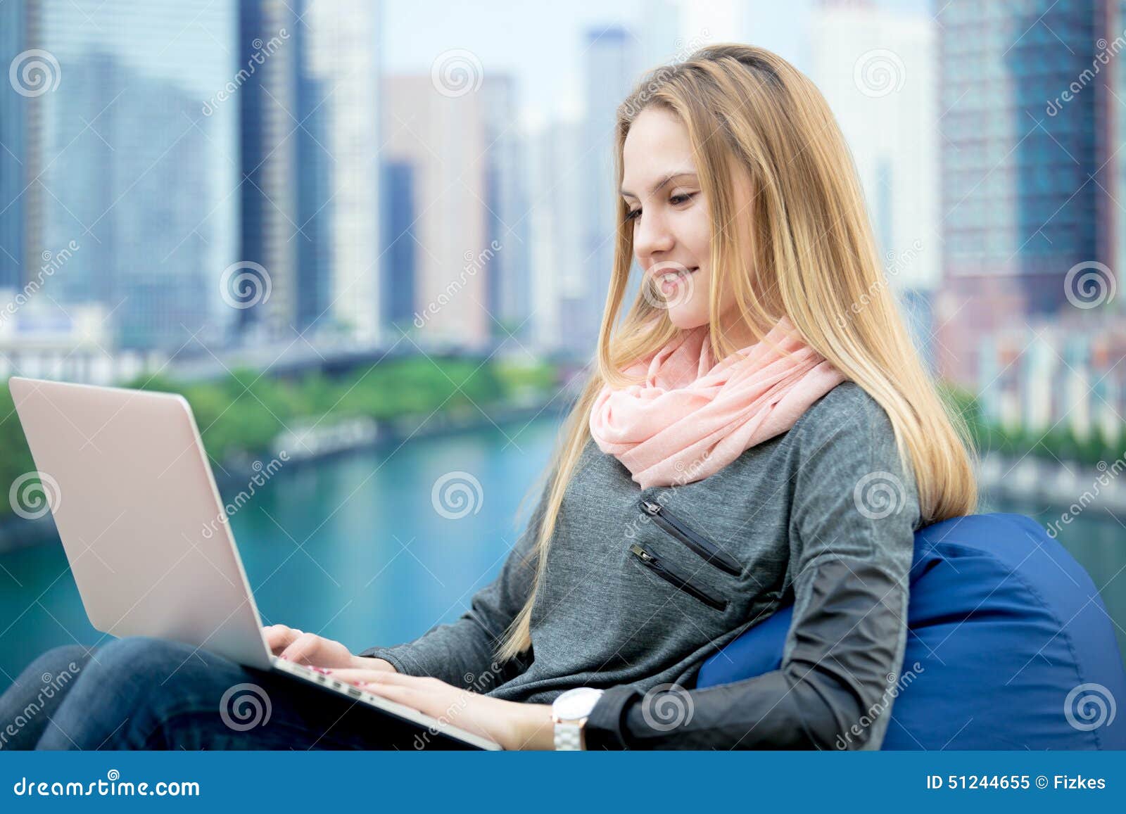 Young Girl Sitting with Laptop, Cityscape on the Background Stock Image ...