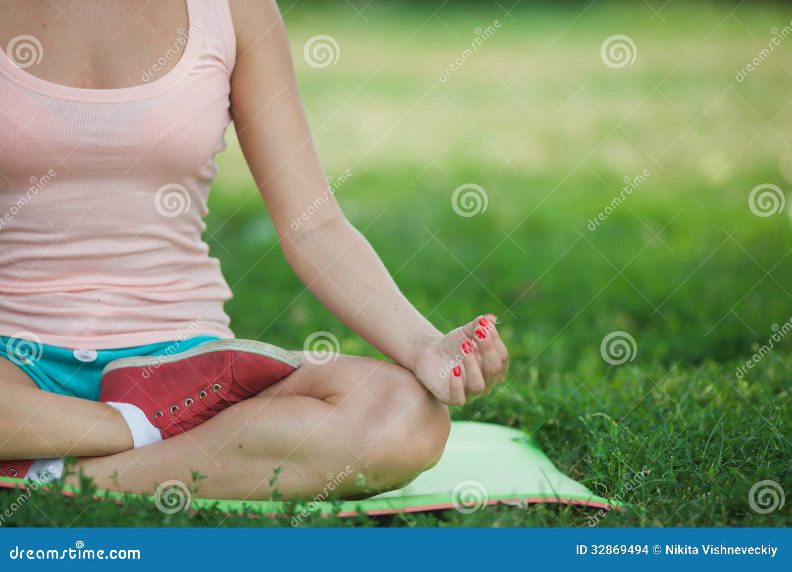 Young Girl Sitting in the Lotus Position Stock Photo - Image of meadow ...