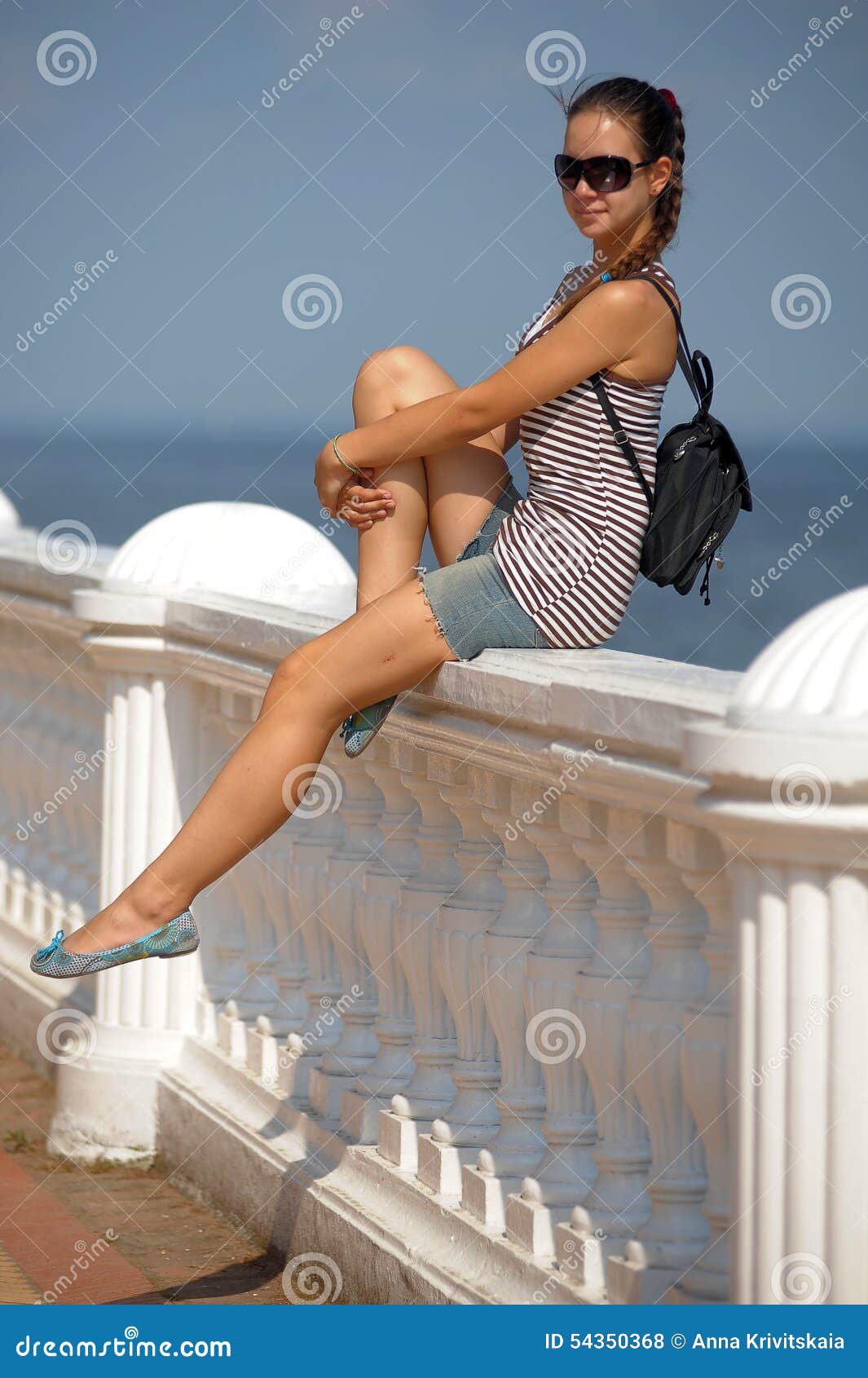 Young Girl Sitting on the Railing Stock Photo - Image of heat, creative ...