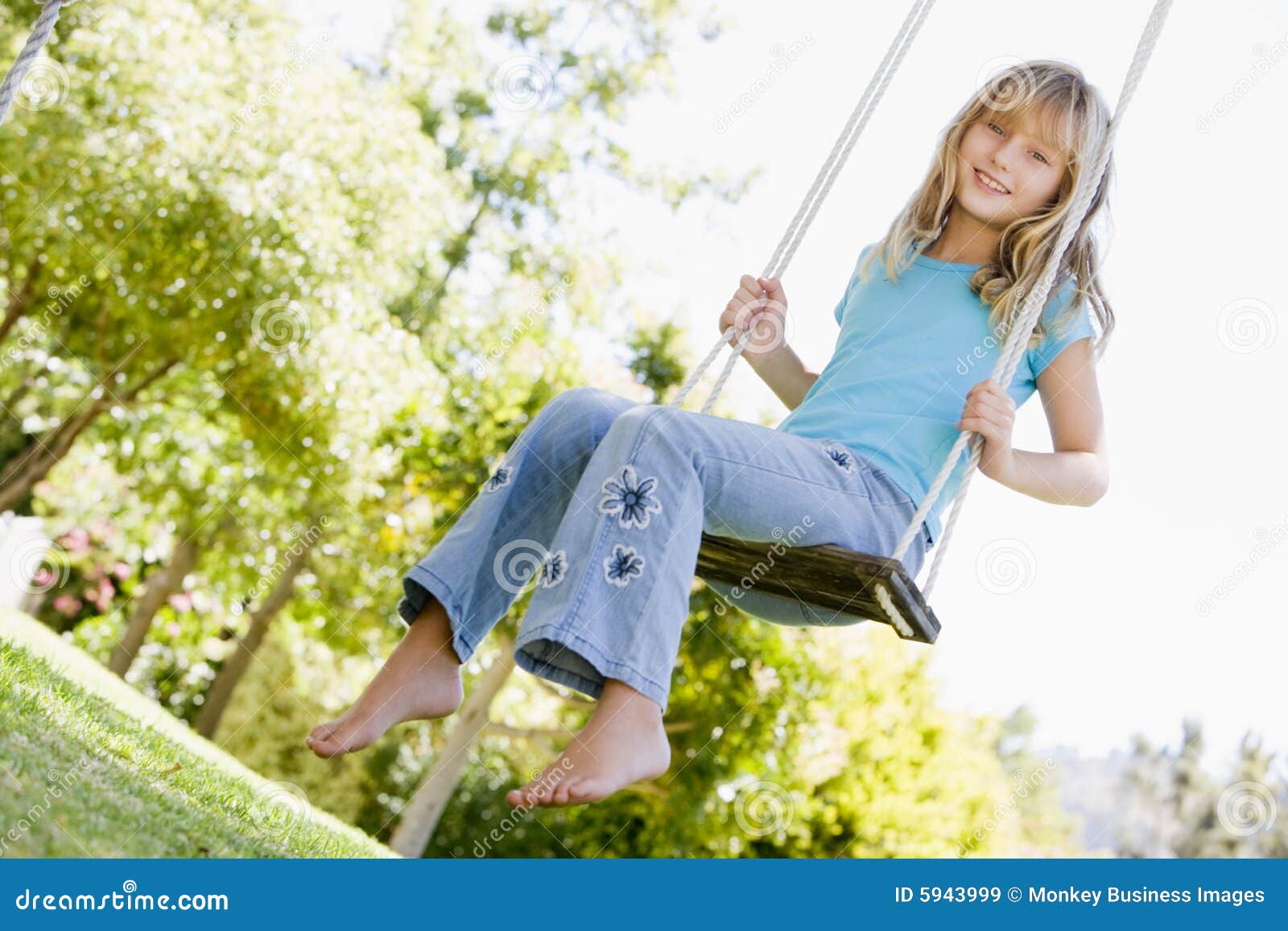 Young Girl Sitting on Swing Smiling Stock Image - Image of girl, swing ...