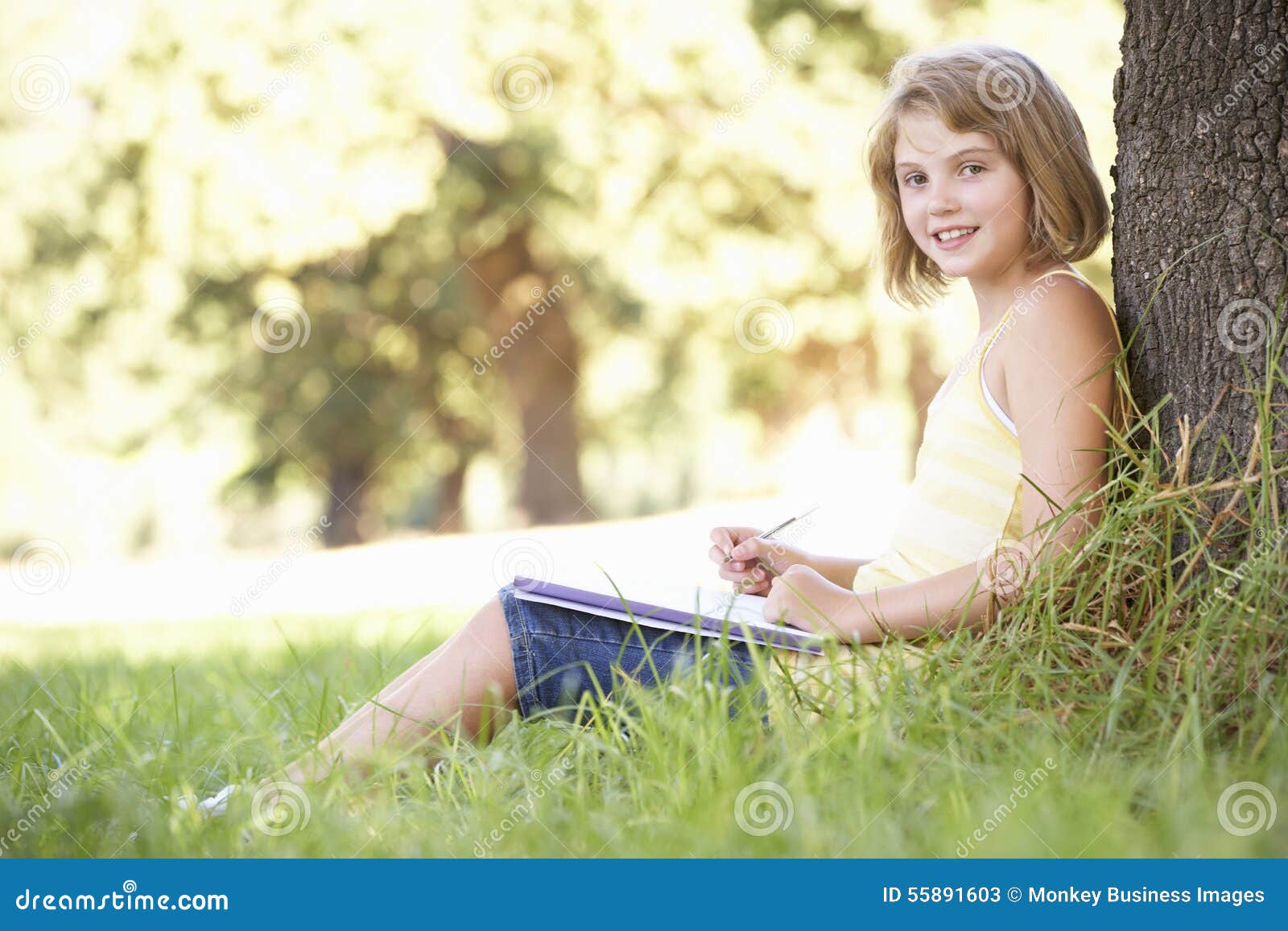 Young Girl Sketching in Countryside Leaning Against Tree Stock Image ...