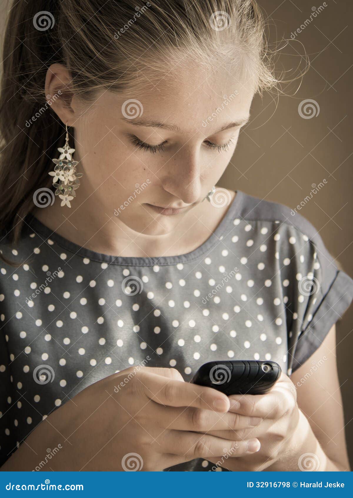 Young girl with smartphone stock photo. Image of electronics - 32916798