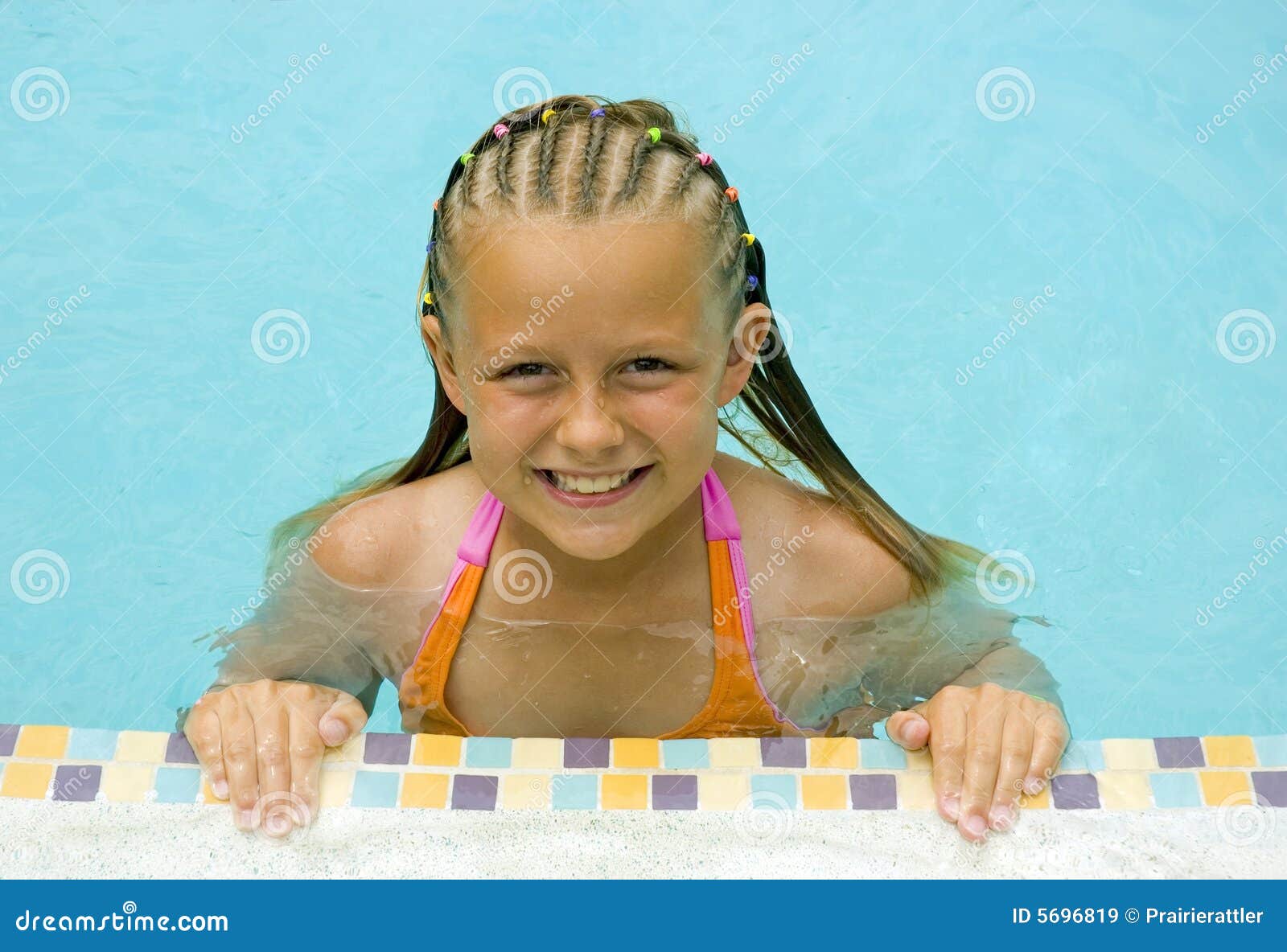 Young Girl Smiles at Poolside Stock Image - Image of cute, braided: 5696819