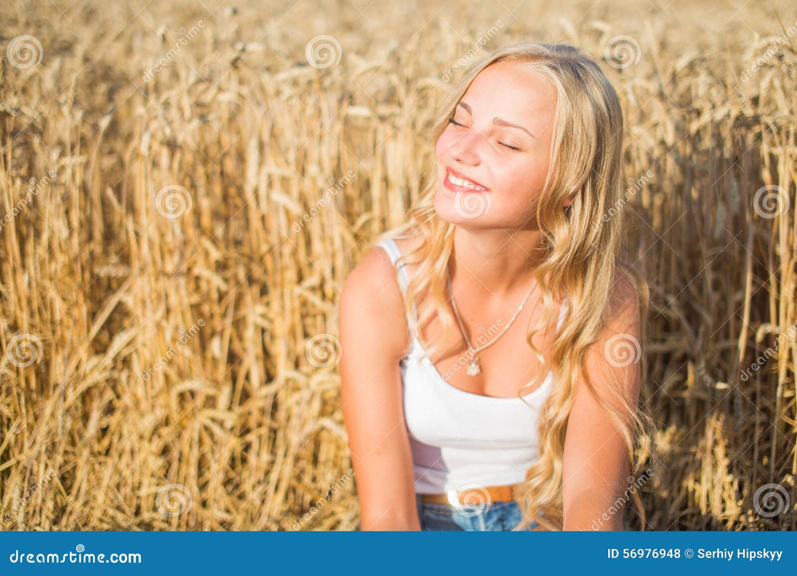 Young Girl is Smiling in the Field Stock Photo - Image of golden ...