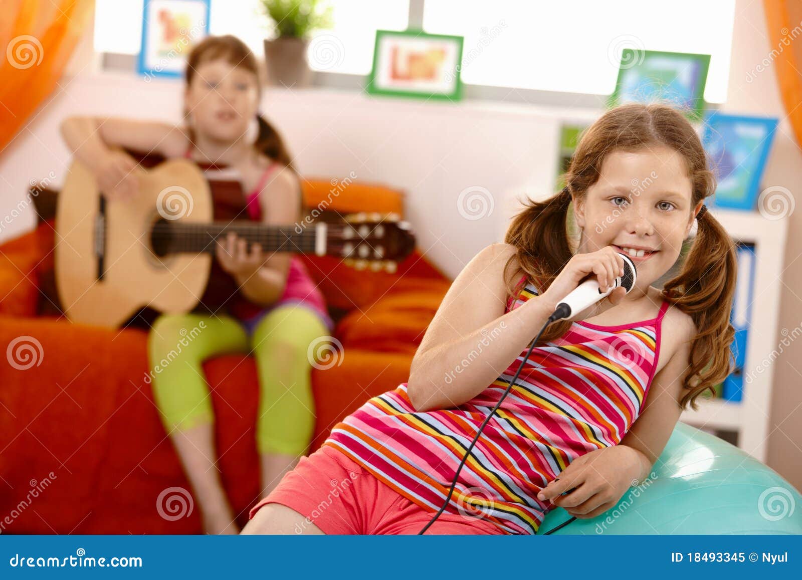 Young Girl Smiling with Microphone in Hand Stock Image - Image of ...