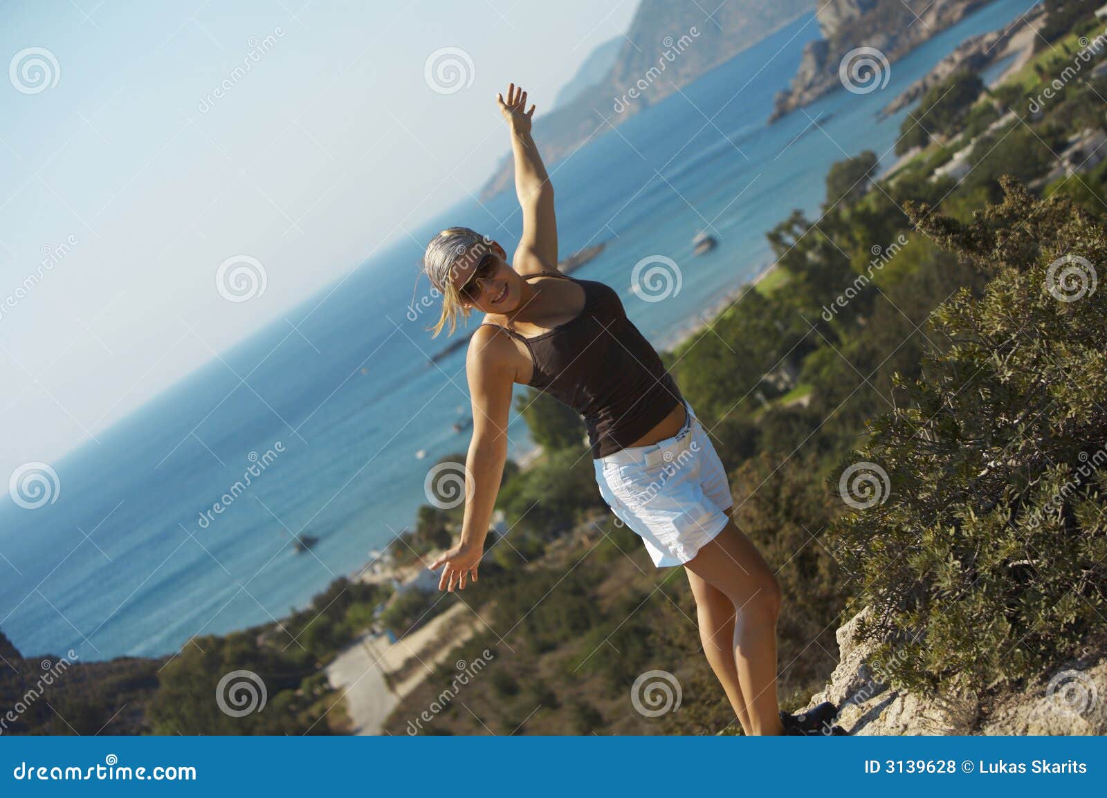 Young Girl Standing on a Cliff Stock Photo - Image of cyan, sunglasses ...