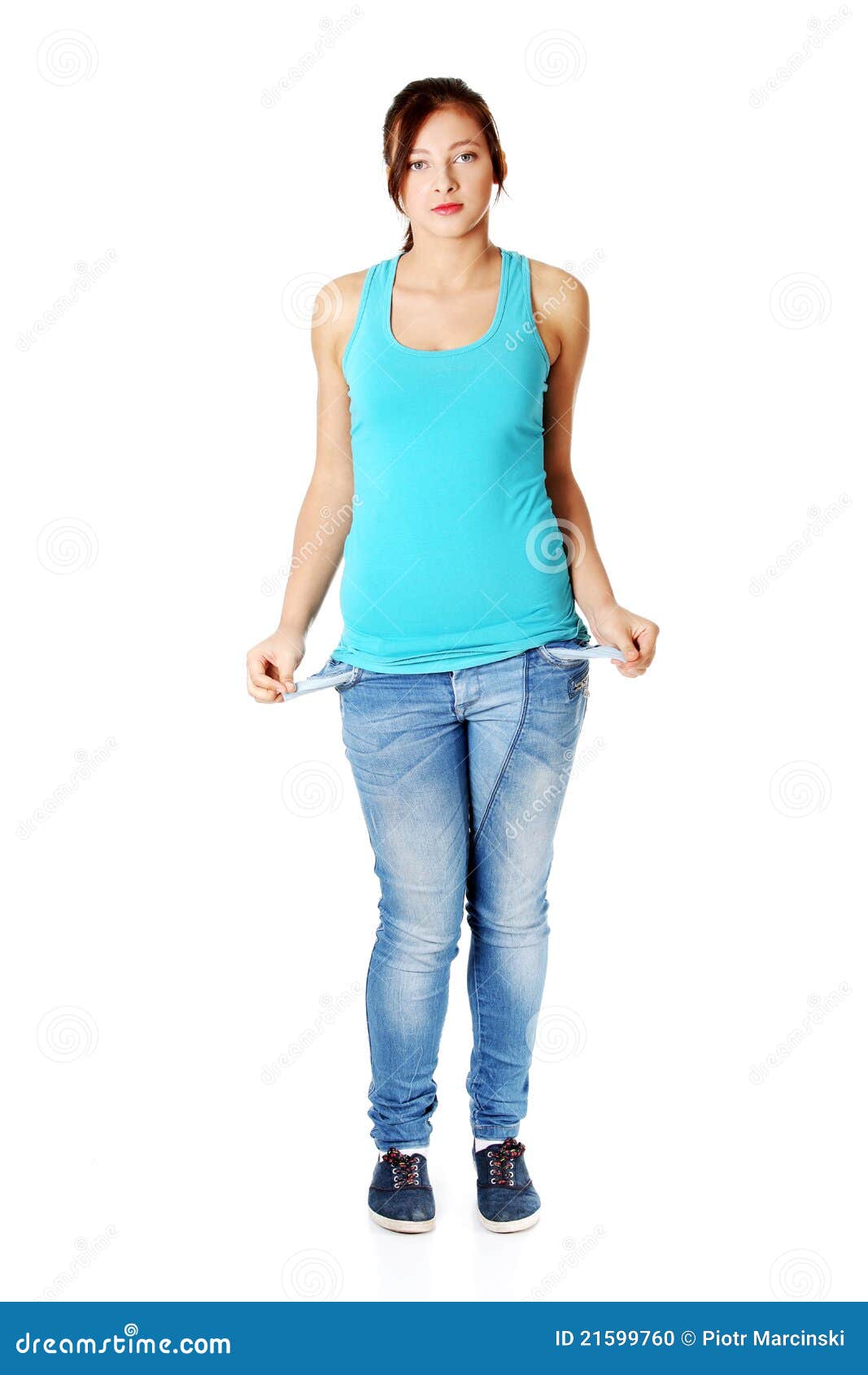 Young Girl Standing and Showing Her Empty Pockets. Stock Photo - Image ...