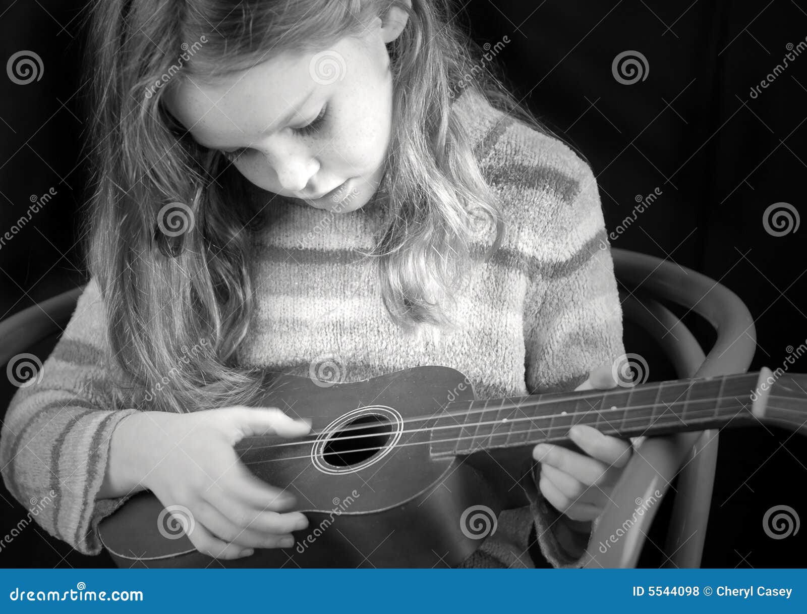 Young Girl Strumming Instrument Stock Photo - Image of skill ...