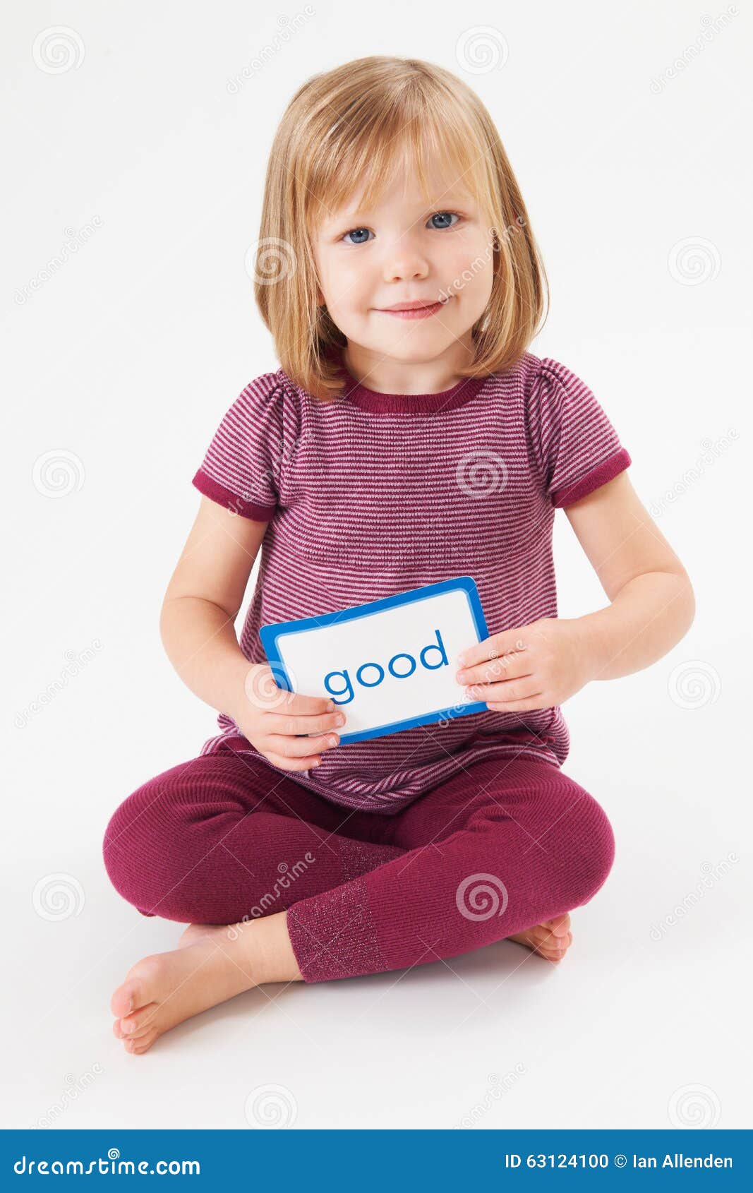Young Girl in Studio Learning To Read Using Flash Card Stock Photo ...