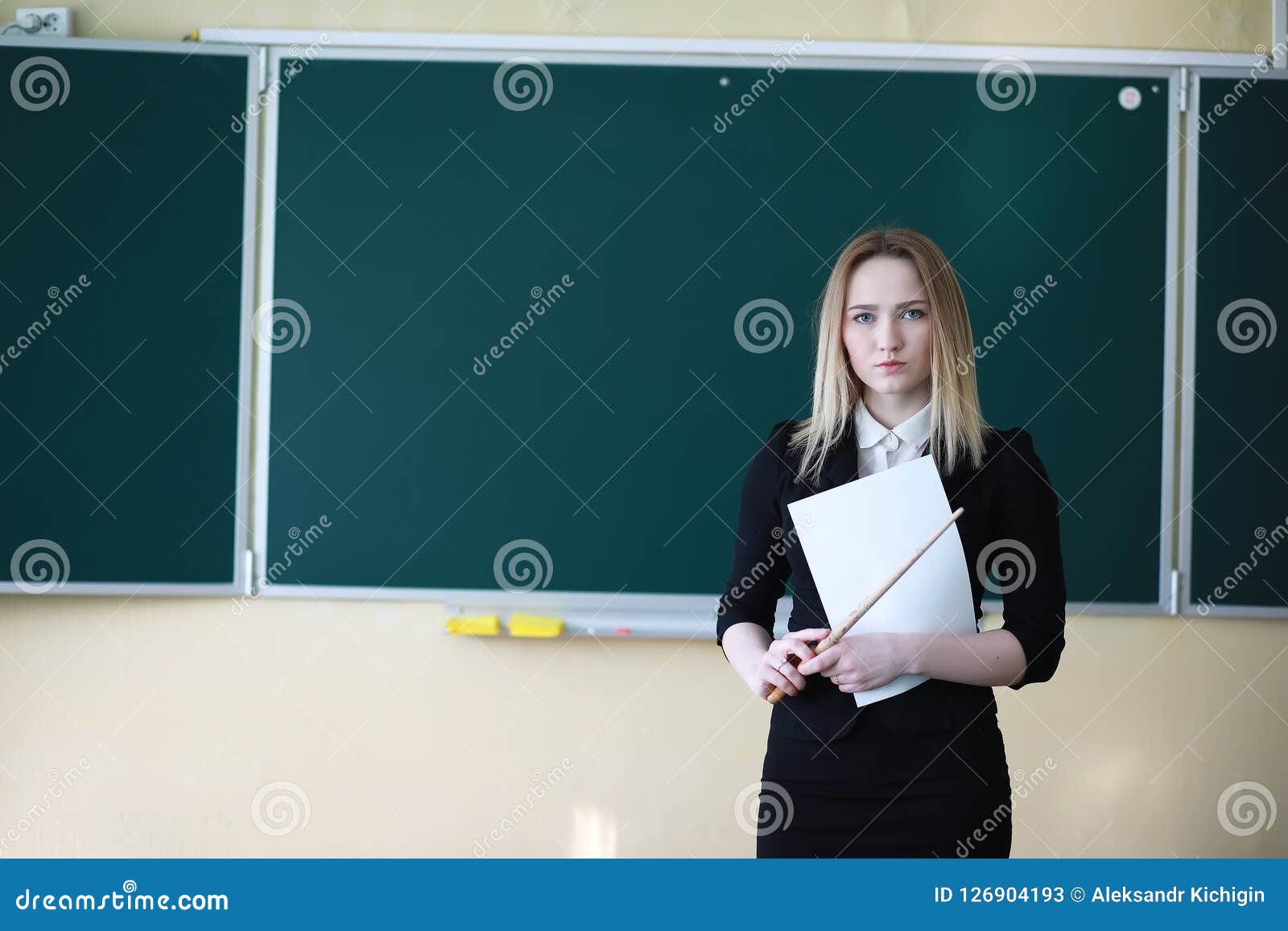 Young Girl Teacher in Primary School Stock Image - Image of desk, hands ...