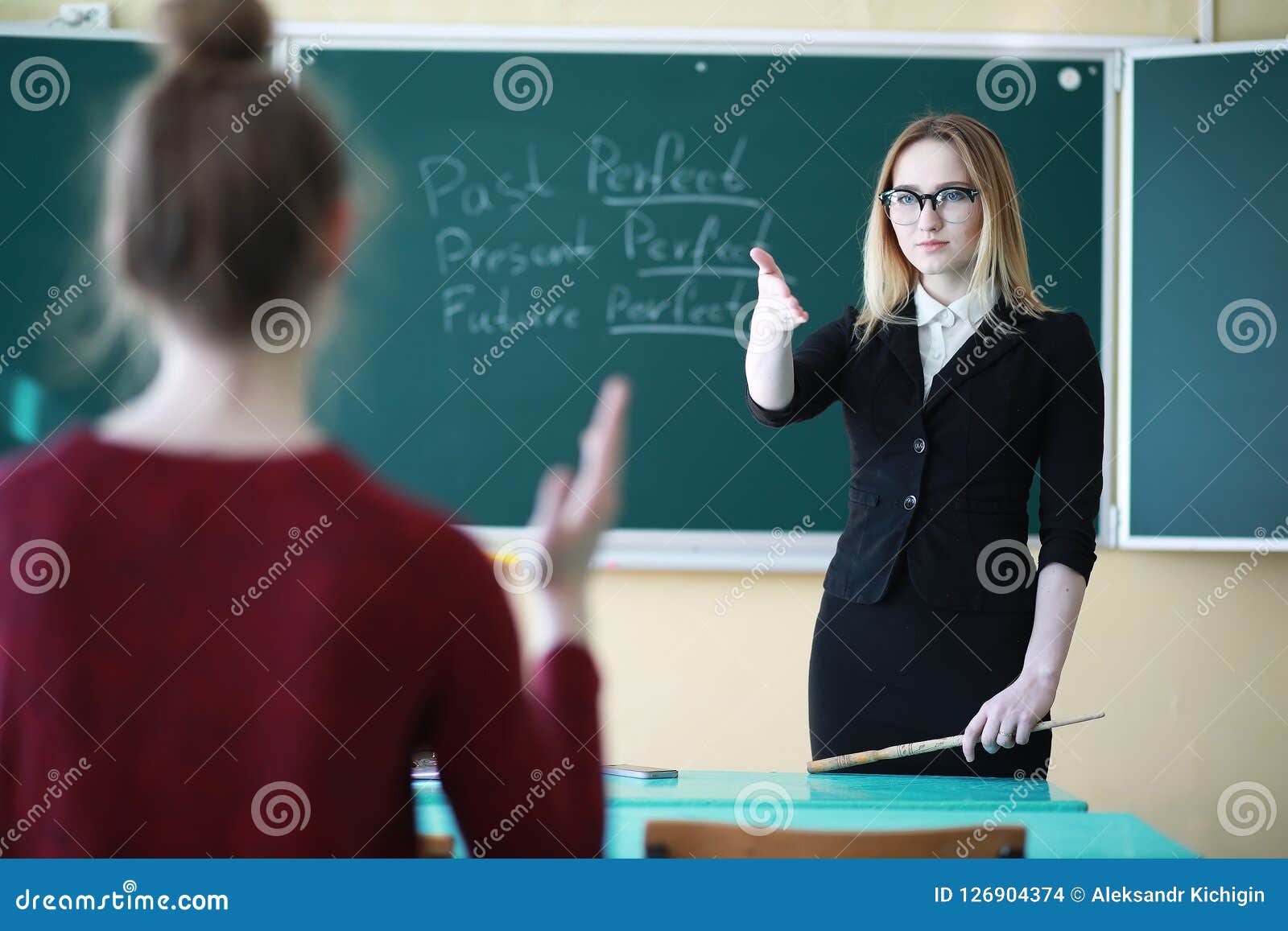 Young Girl Teacher in Primary School Stock Photo - Image of board ...