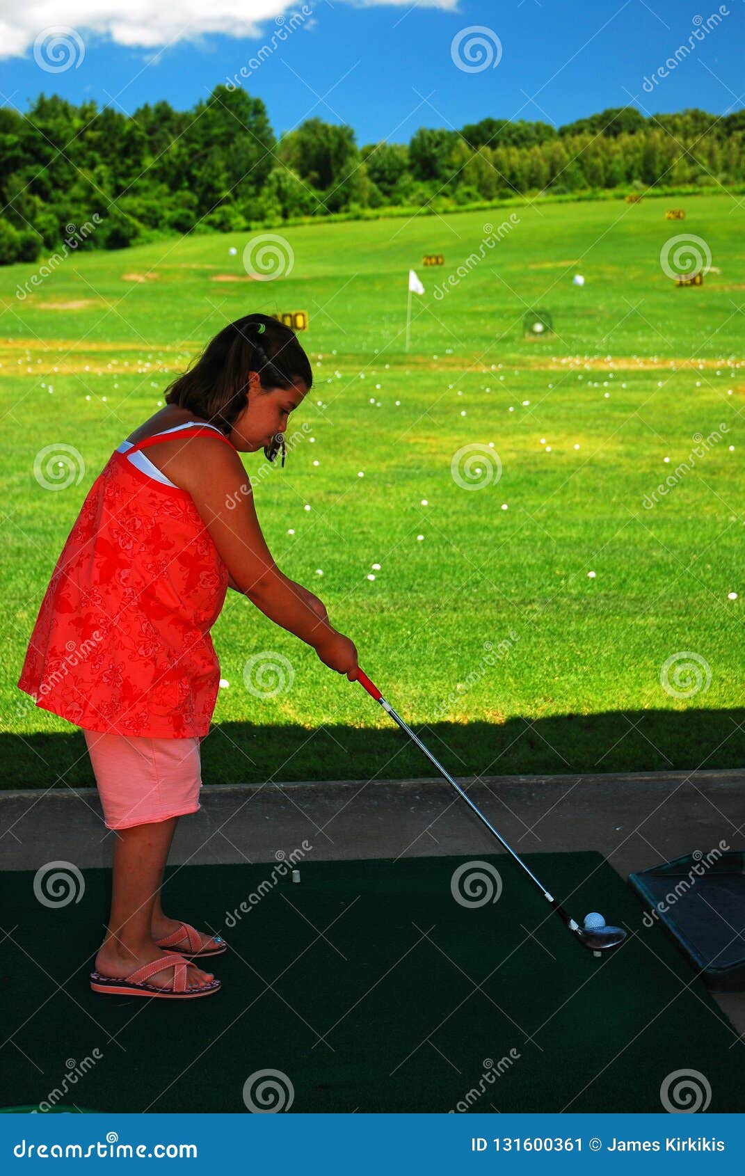 Teeing off at a golf range editorial photo. Image of female - 131600361