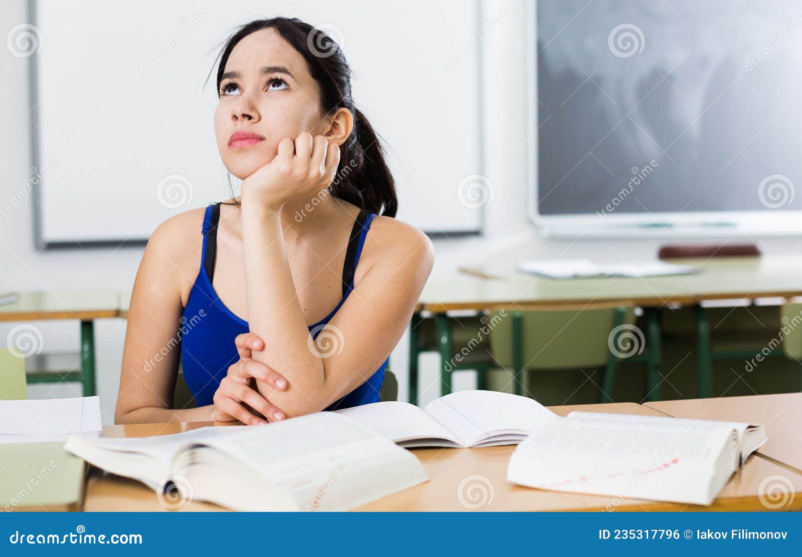 Young Girl is Thinking about Difficult Task at the Desk Stock Photo ...
