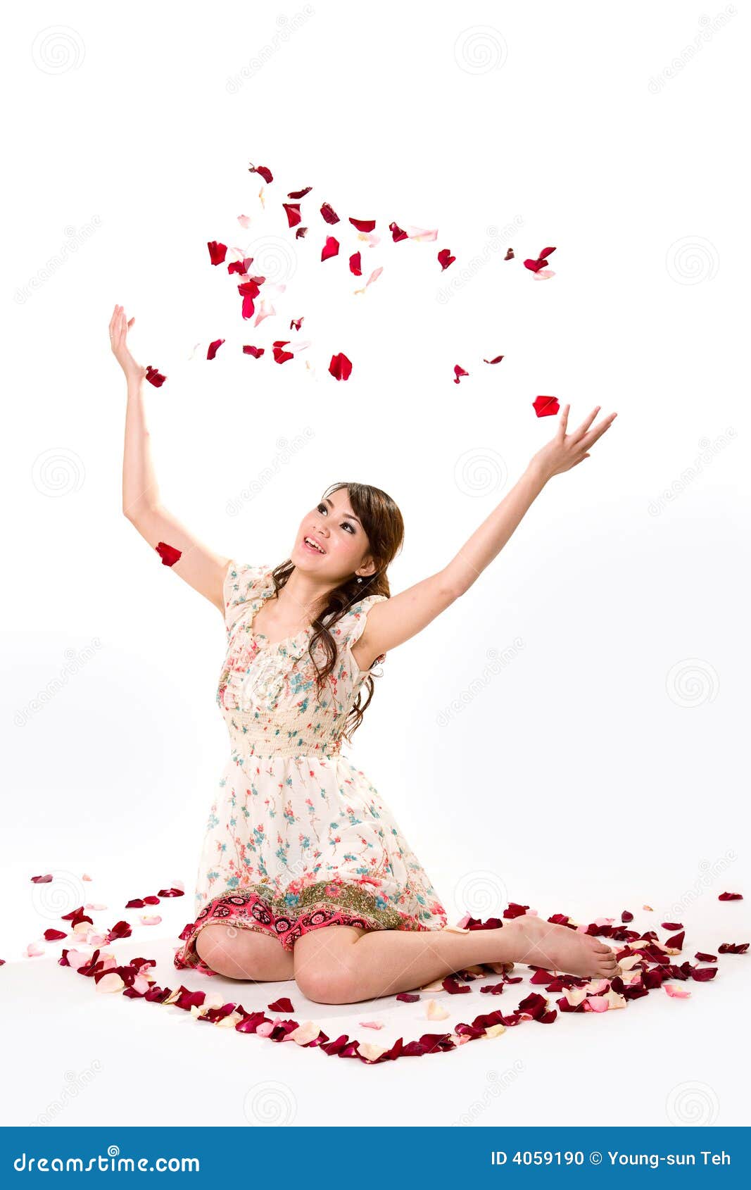 Young Girl Tossing Rose Petal Stock Photo - Image of beautiful, looking ...