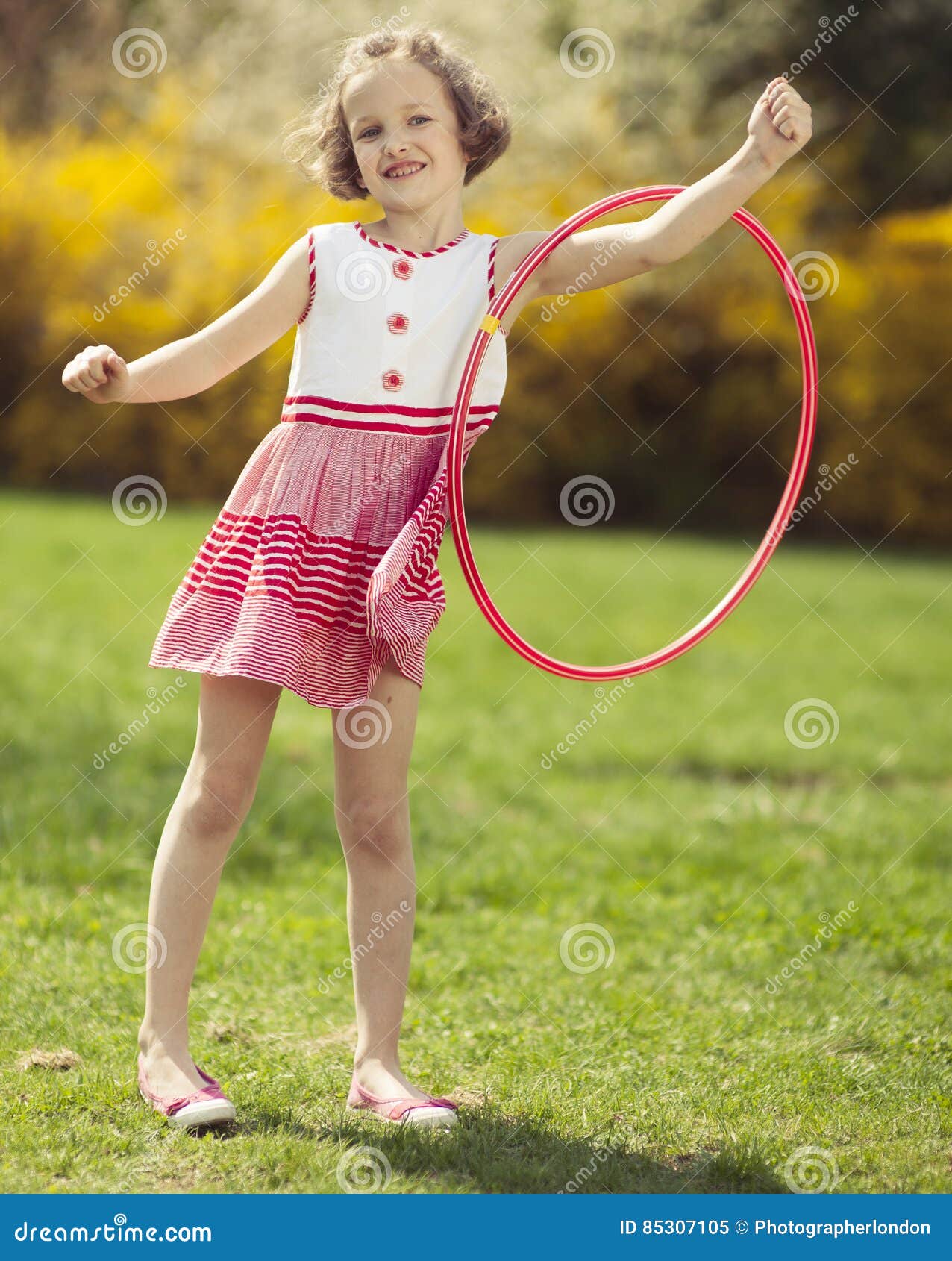 Young Girl Using Hula Hoop on Arm in a Park Stock Image - Image of ...