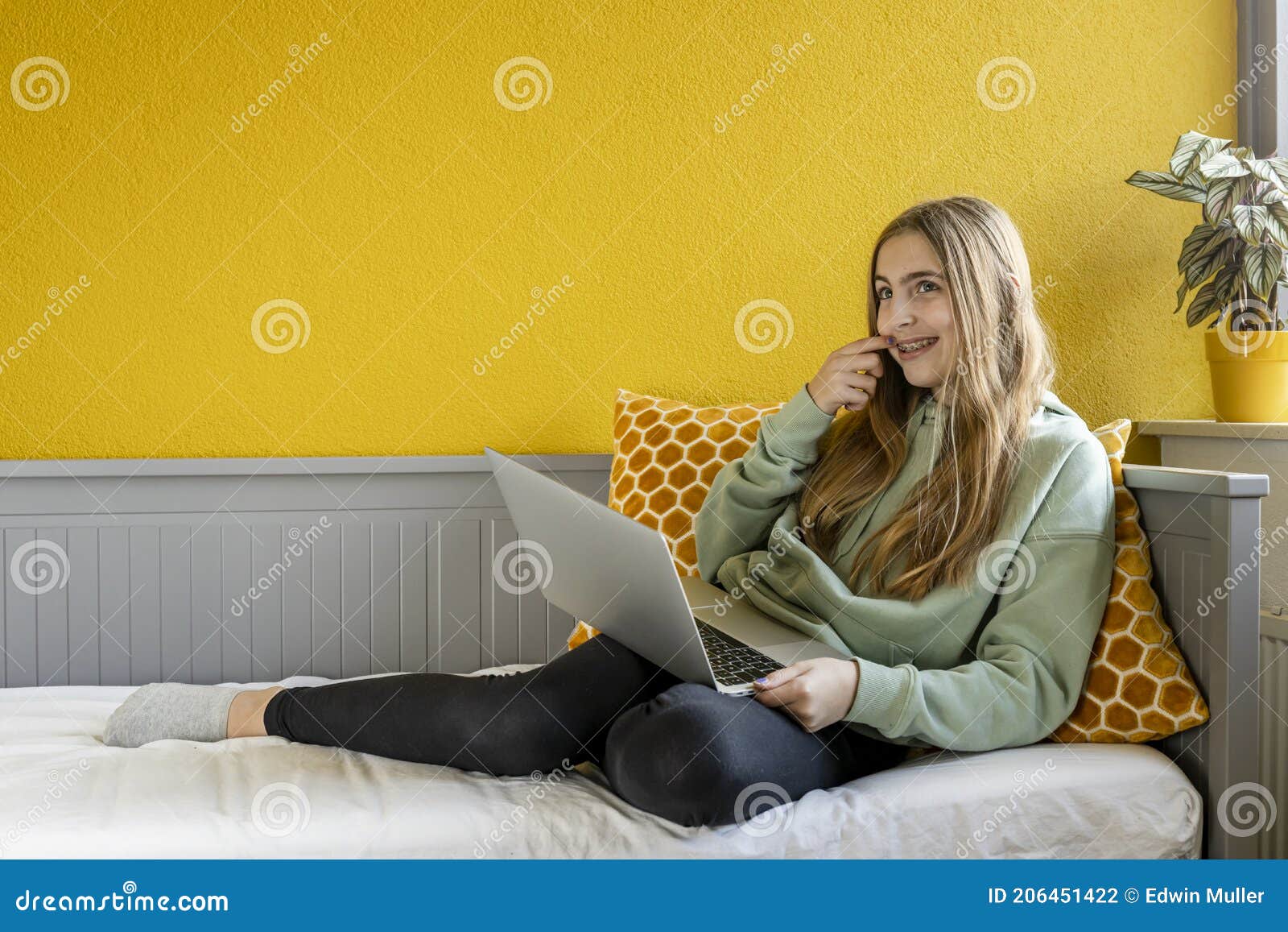 Young Girl Using Laptop on Her Bed Stock Photo - Image of person ...