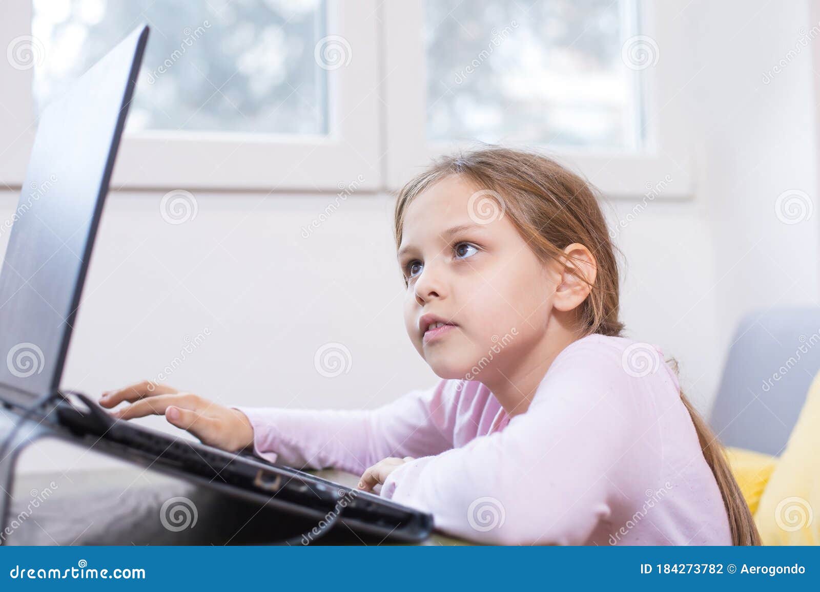 Young Girl Using Laptop at Home Stock Photo - Image of childhood ...