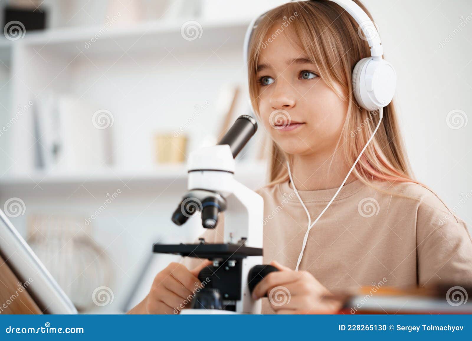 Young Girl Using Microscope during Online Lesson Education at Home ...