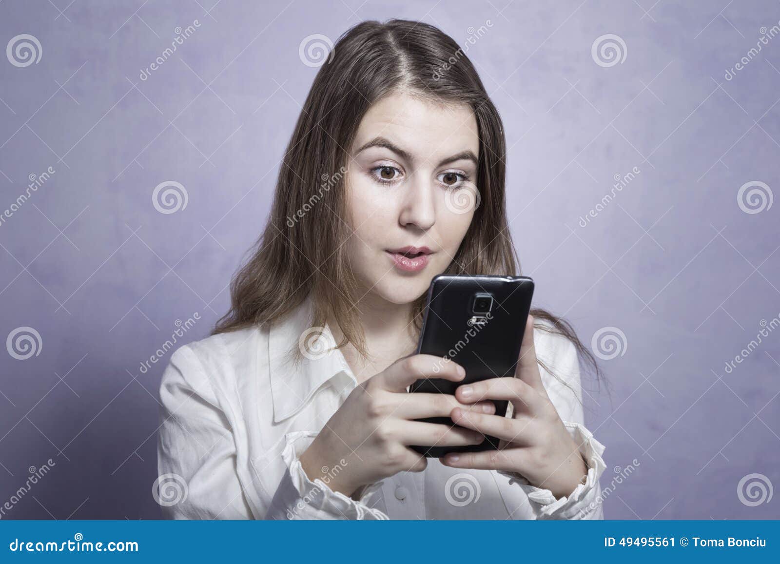 Young Girl Using a Smartphone Stock Image - Image of cheerful, smile ...