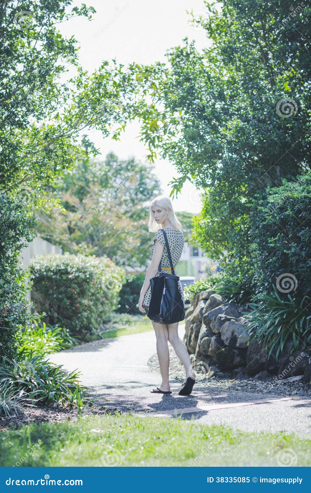 Young Girl Walking through Park Stock Image - Image of dress, walking ...