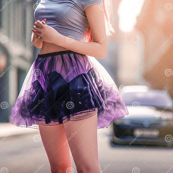 Young Girl Wearing A Tight Black Miniskirt In The Street On A Sunny