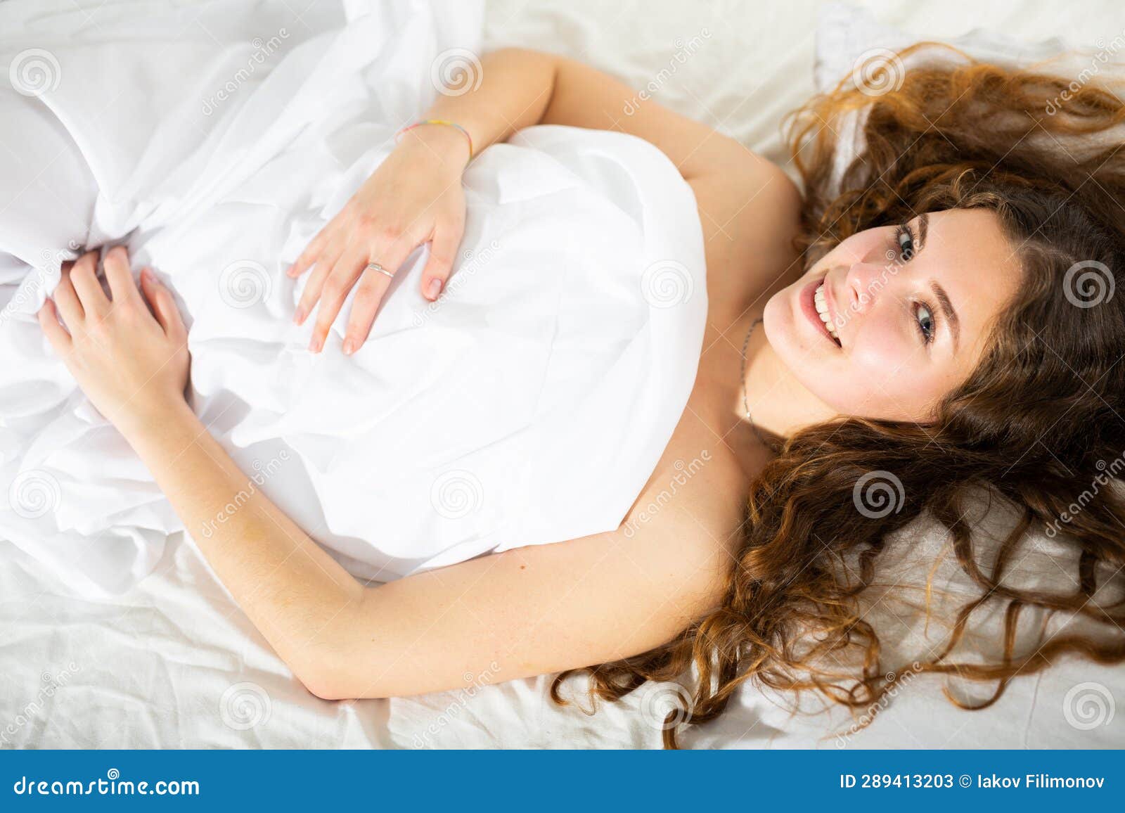 Young Girl on White Sheets in Bed Closeup Stock Image - Image of posing ...