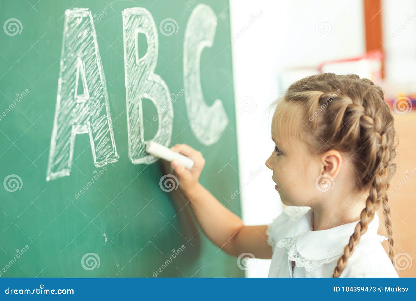 Young Girl Writing ABC on Green Chalkboard Stock Image - Image of used ...