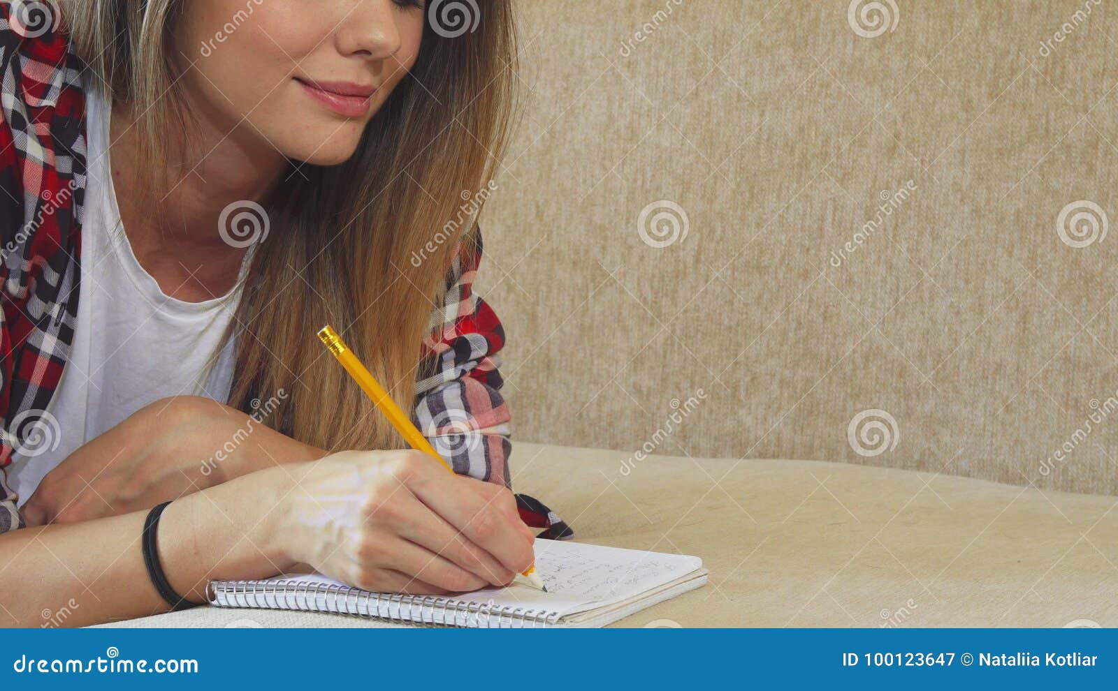 The Young Girl is Writing in Her Notebook Stock Video - Video of couch ...