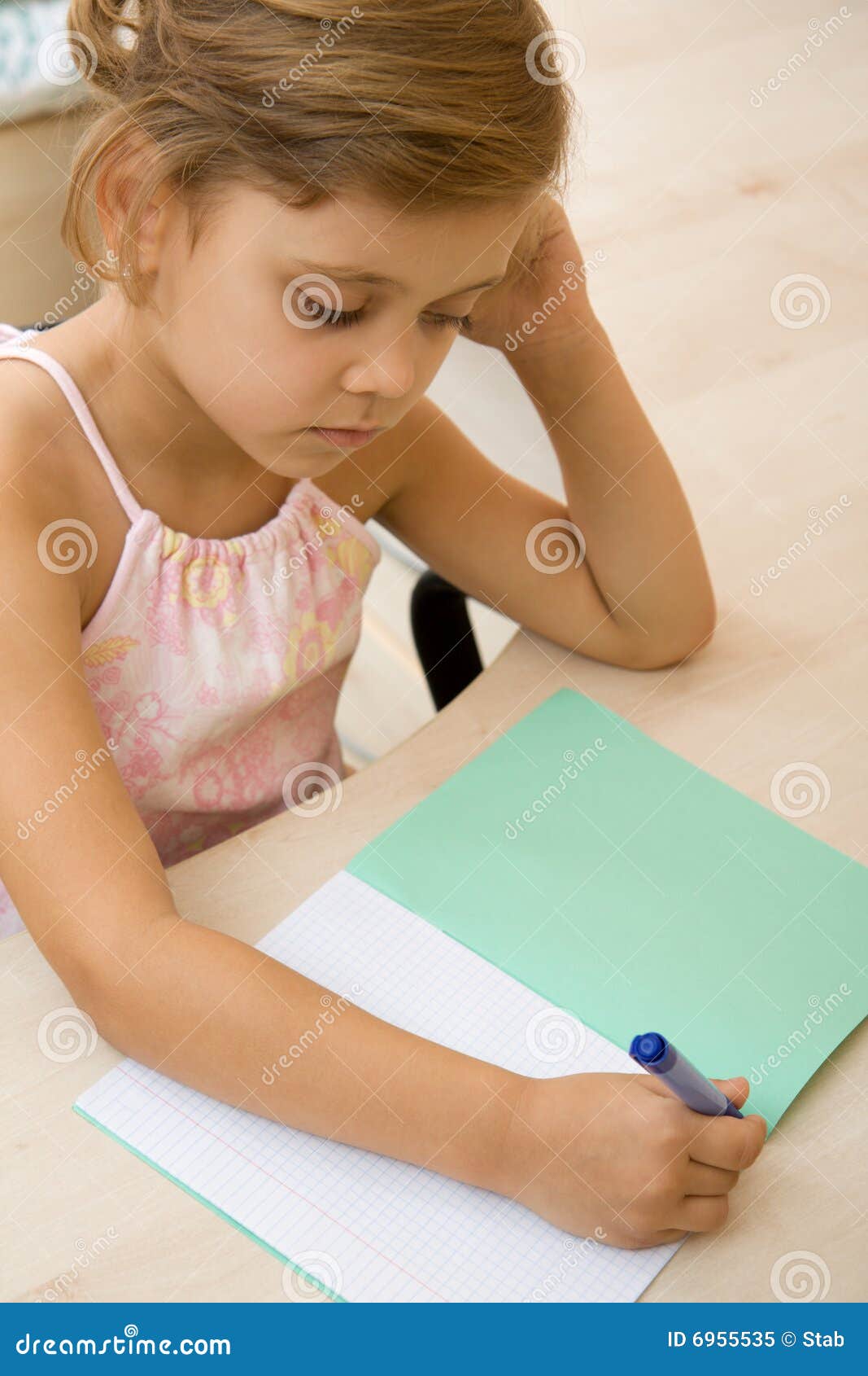 Young Girl Writing in a Notebook Stock Image - Image of little ...