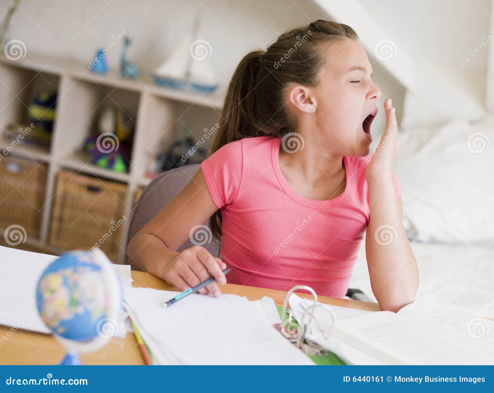 Young Girl Yawning, Doing Her Homework Stock Image - Image of ...