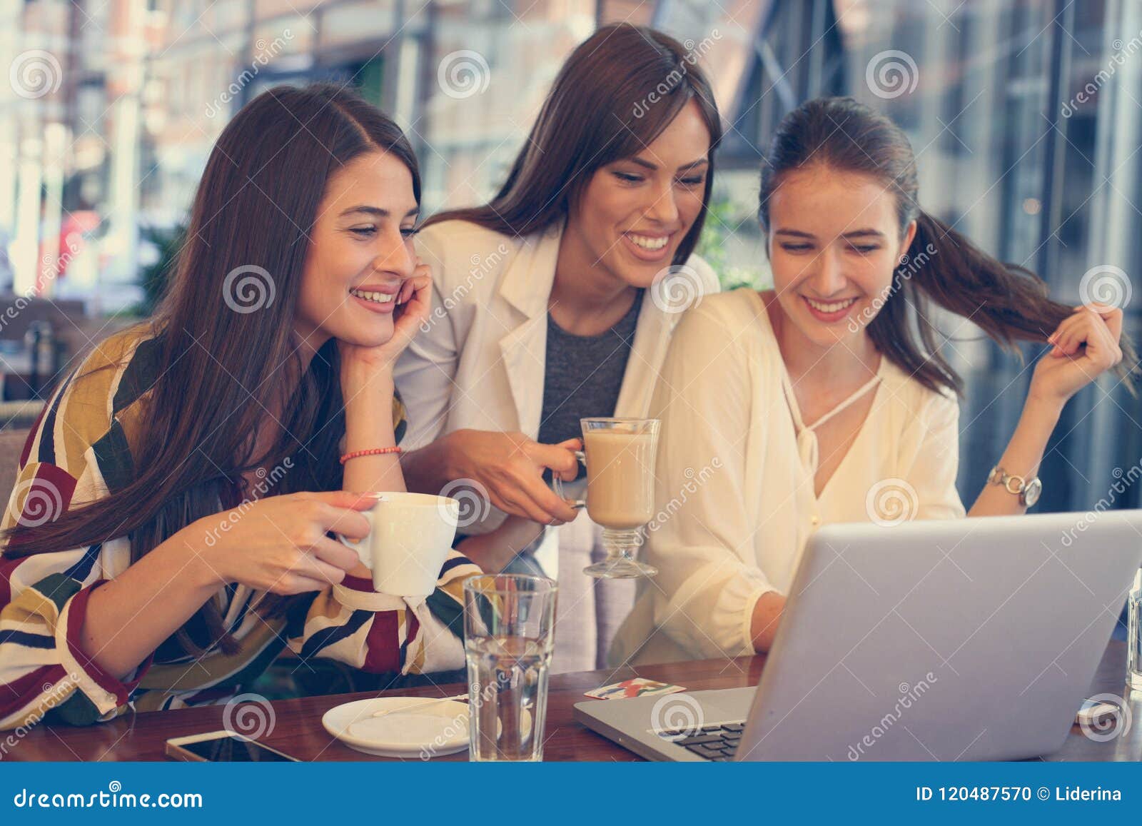 Young Girls Drinking Coffee at Cafe. Stock Photo - Image of ...