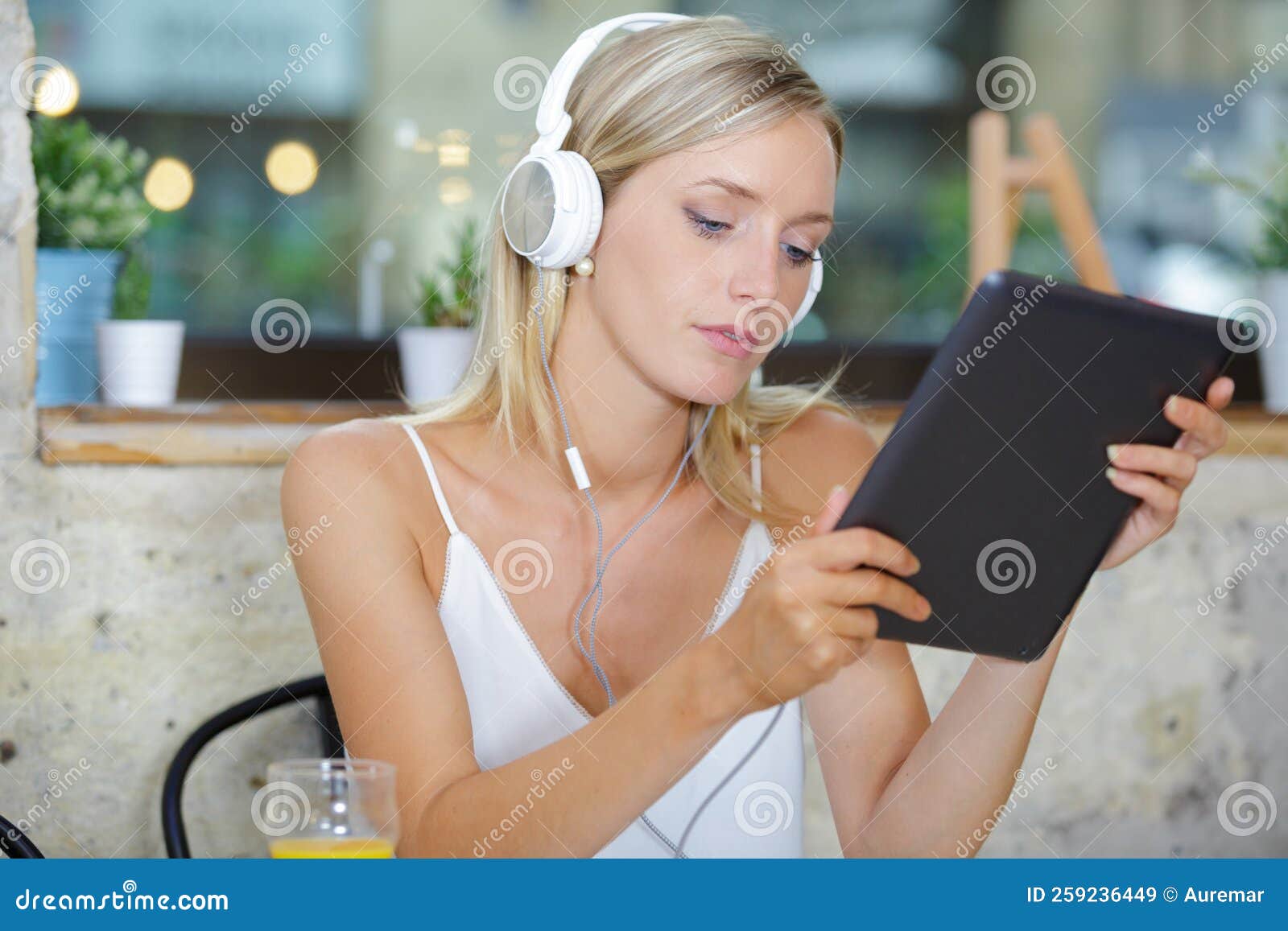 Young Gorgeous Woman Using Tablet in Coffee Shop Stock Image - Image of ...