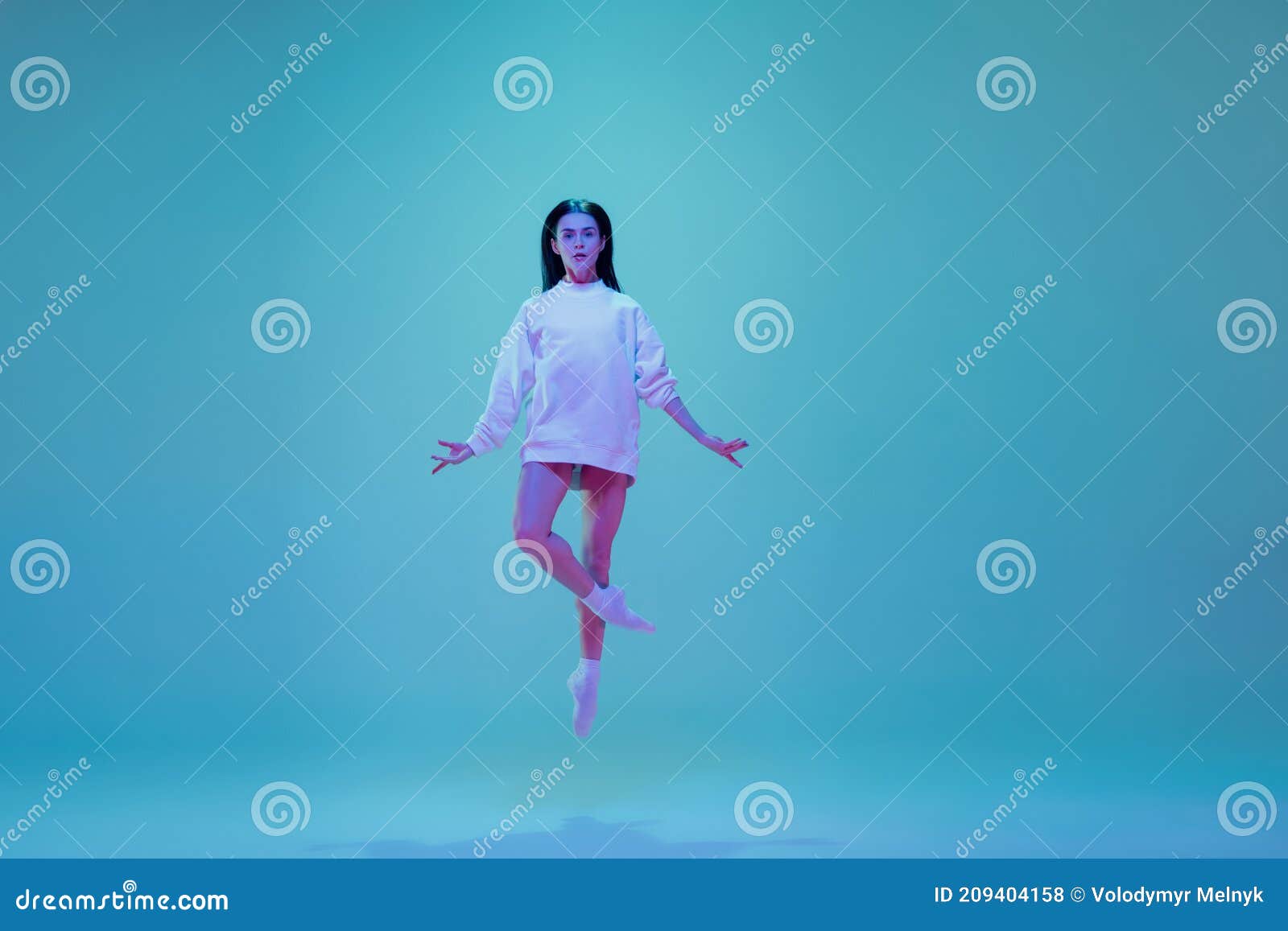 Young and Graceful Ballet Dancer on Blue Studio Background in Neon ...