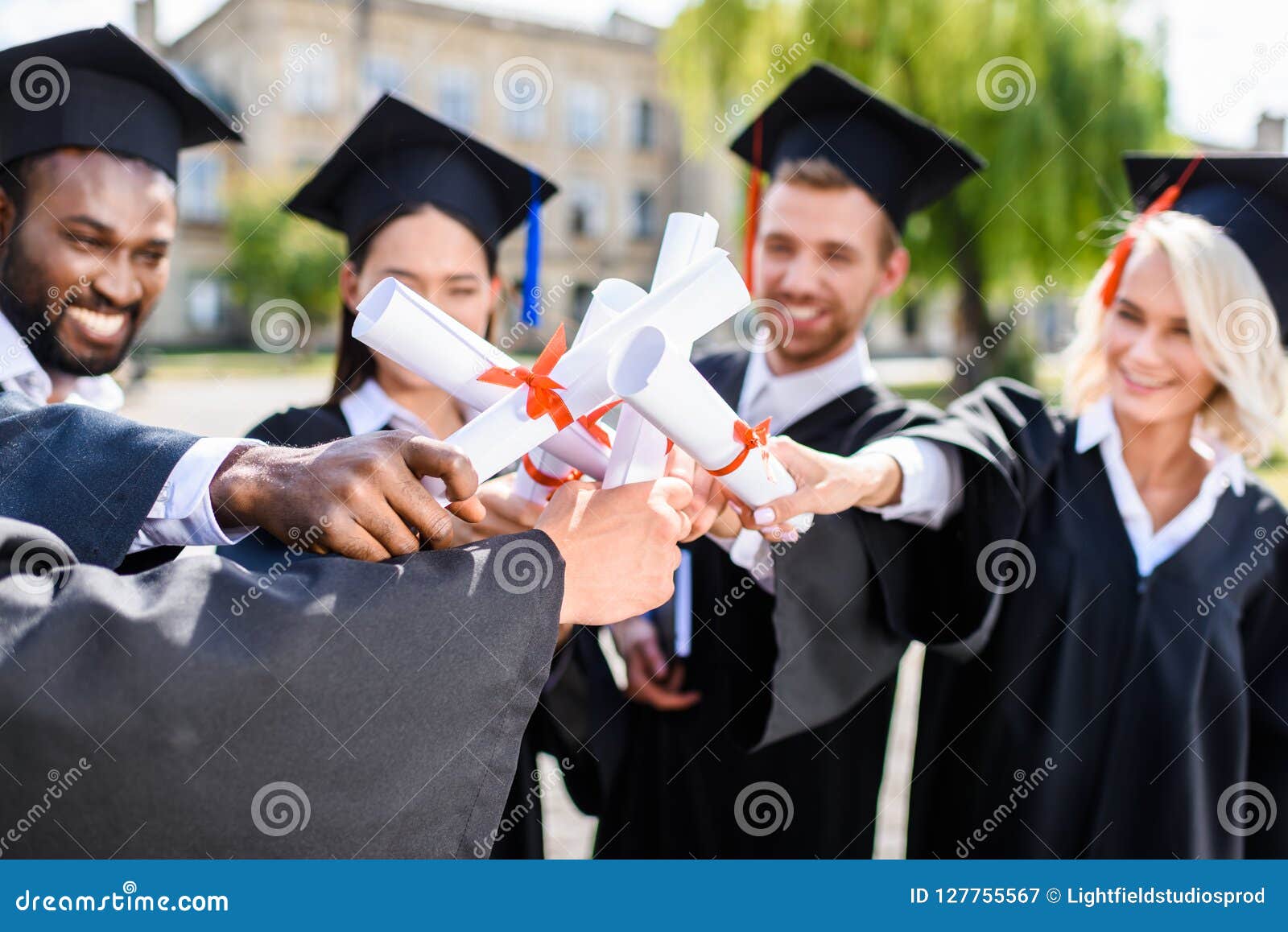 Young Graduated Students Making Team Gesture Stock Image - Image of ...