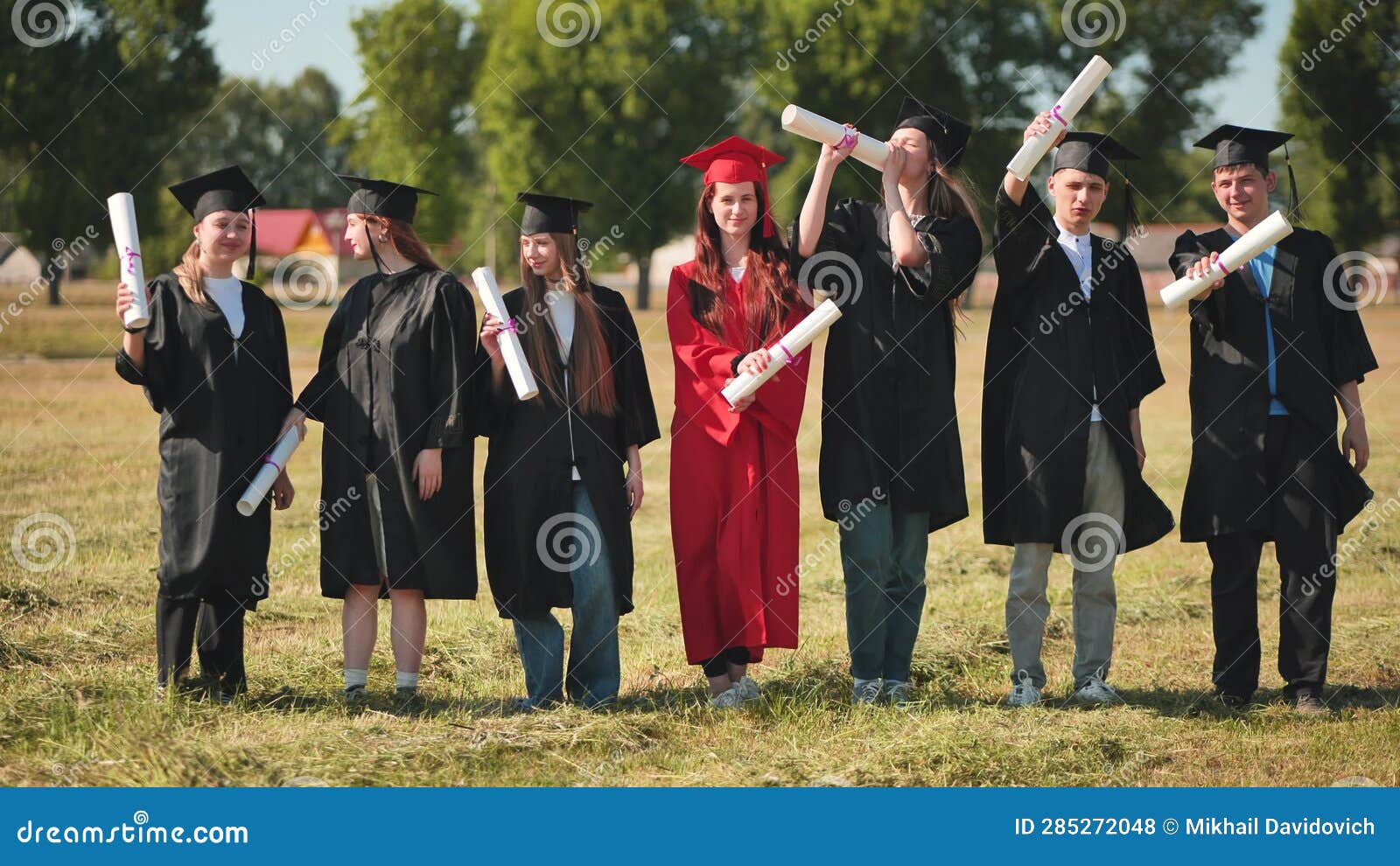 Young Graduates Pose with Diplomas in Hand on the Street. Stock Footage ...