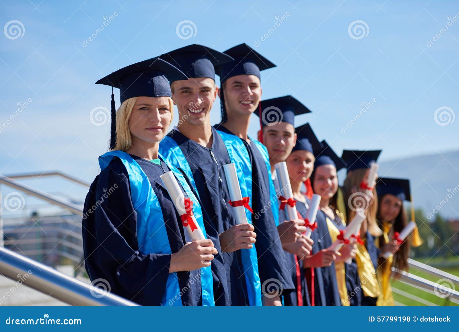 Young Graduates Students Group Stock Photo - Image of pretty, gown ...