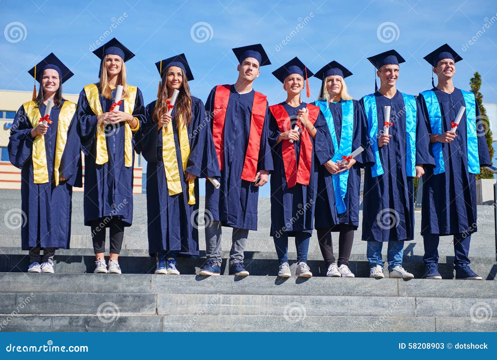 Young Graduates Students Group Stock Image - Image of female, gown ...