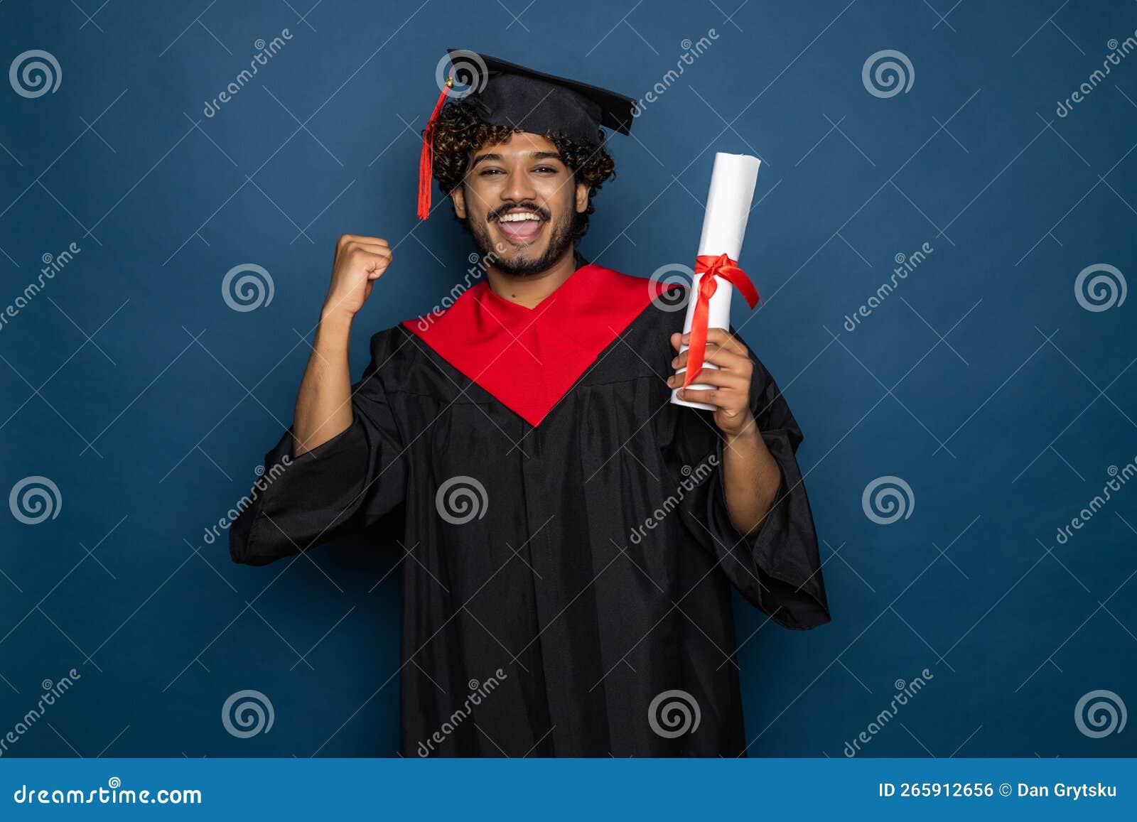 Young Graduation Man Holding Certificate Isolated on Blue Background ...